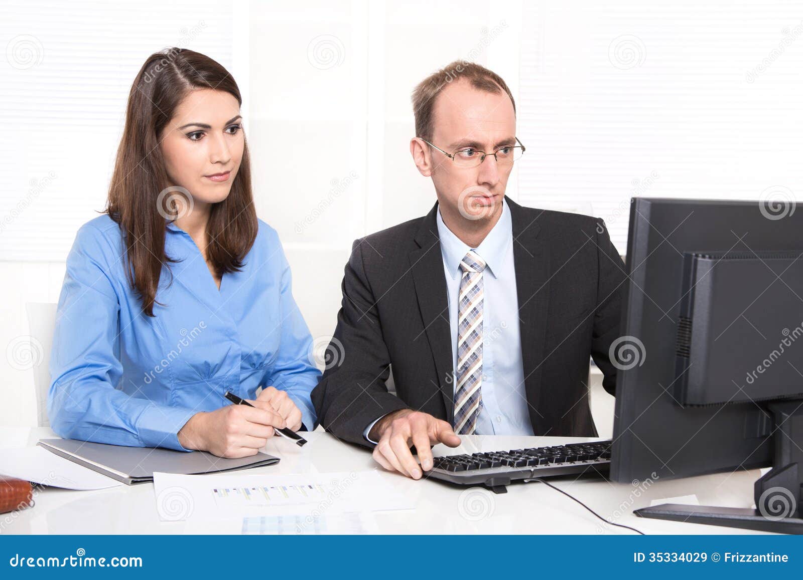 Two Business People Sitting at Desk. Stock Image - Image of consulting ...