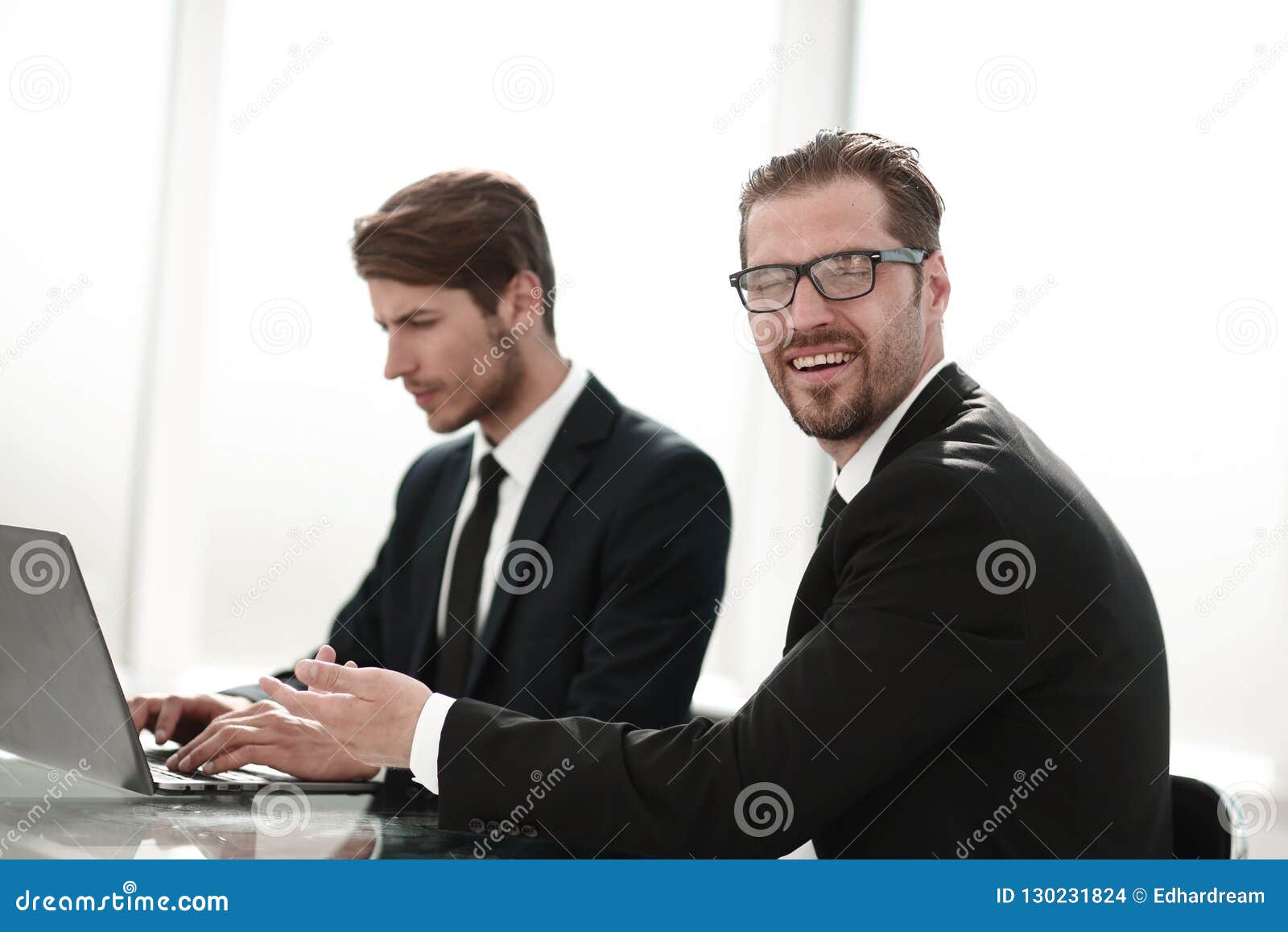Two Business People Sitting at the Desk Stock Photo - Image of concept ...