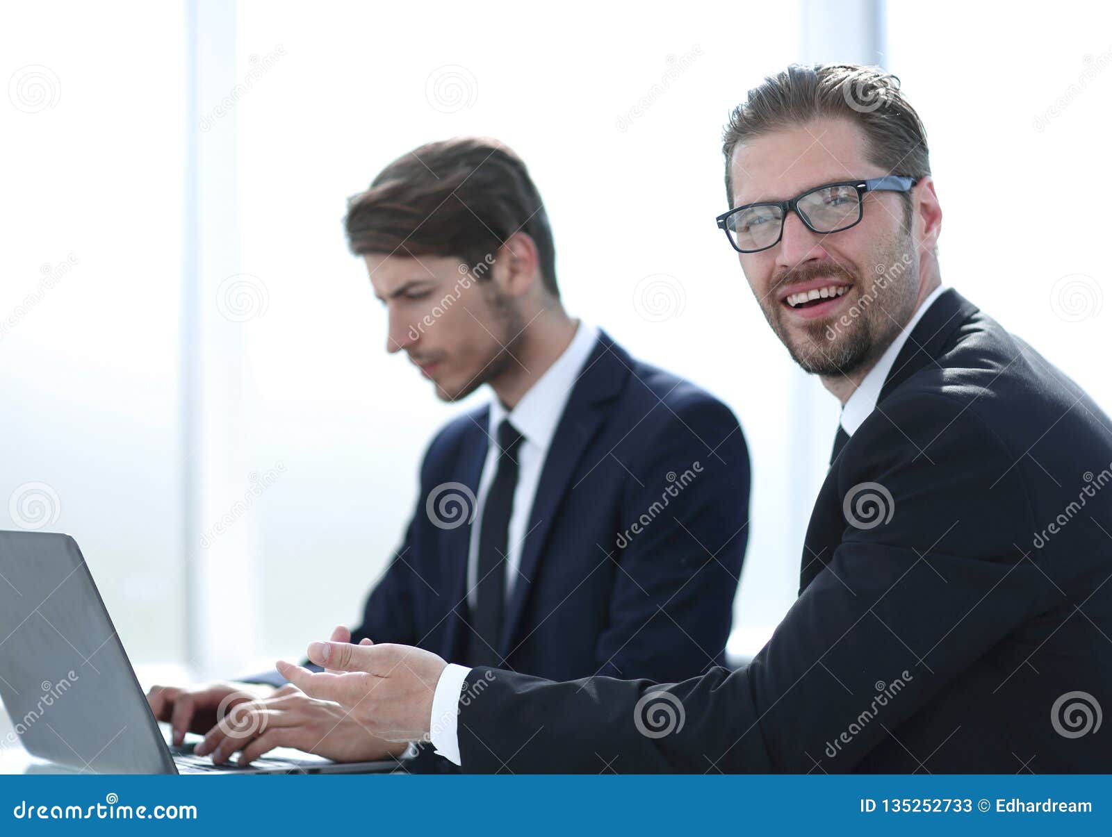 Two Business People Sitting at the Desk Stock Image - Image of adult ...
