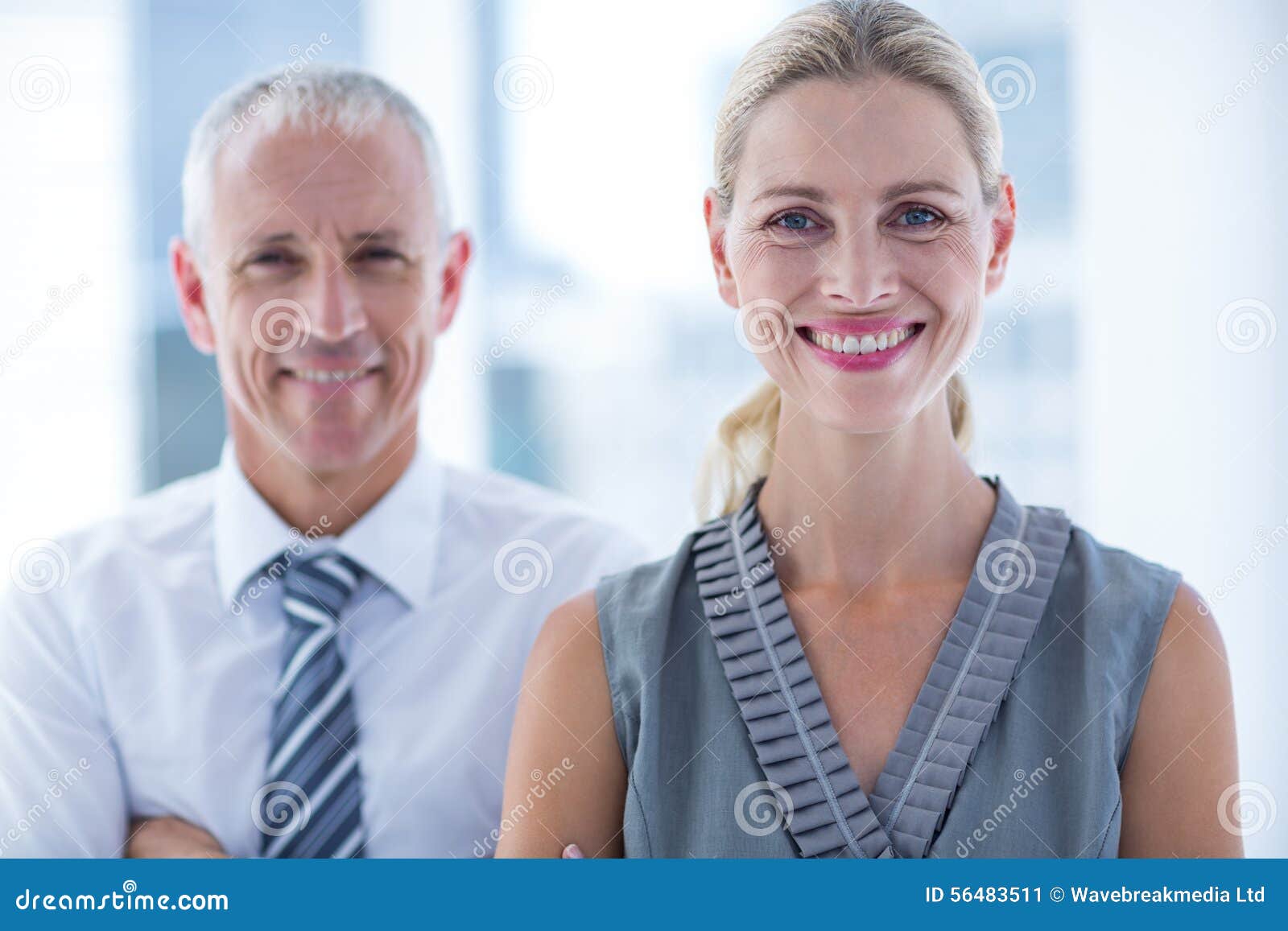 Two Business People Smiling at the Camera in the Office Stock Image ...