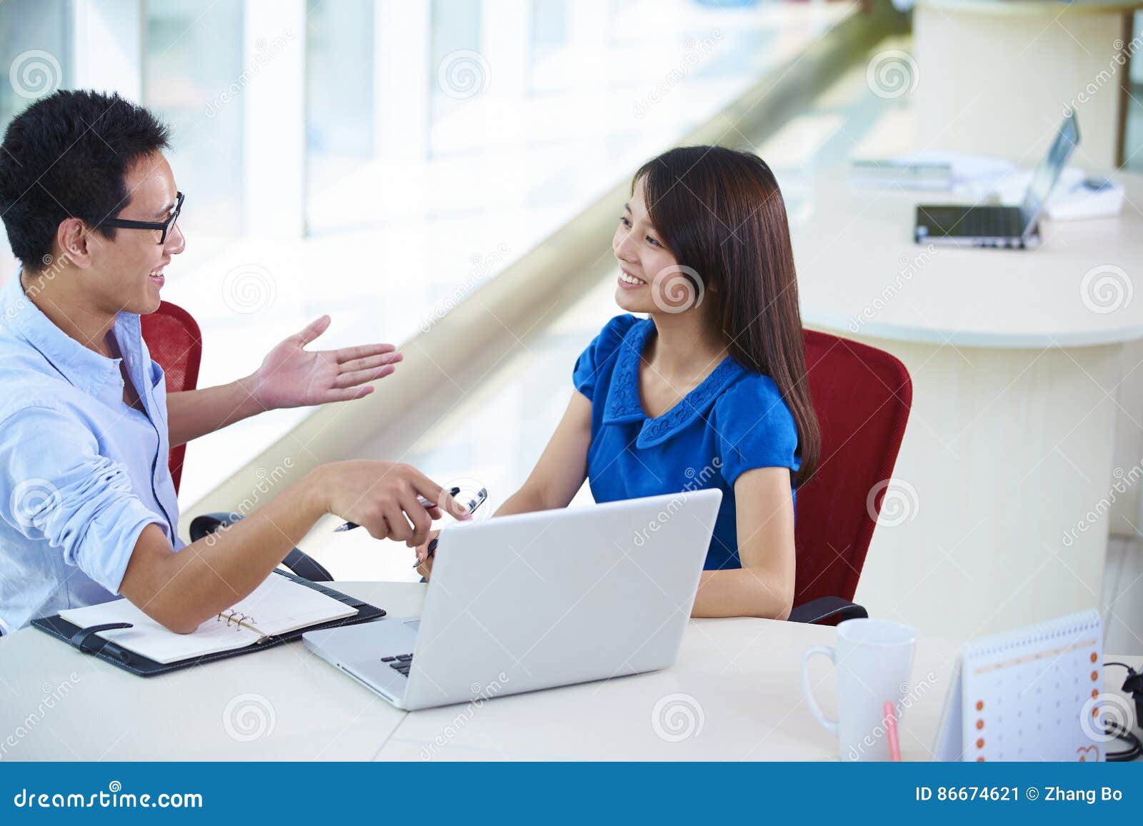 Two Business People Talking in the Office Stock Image - Image of women ...