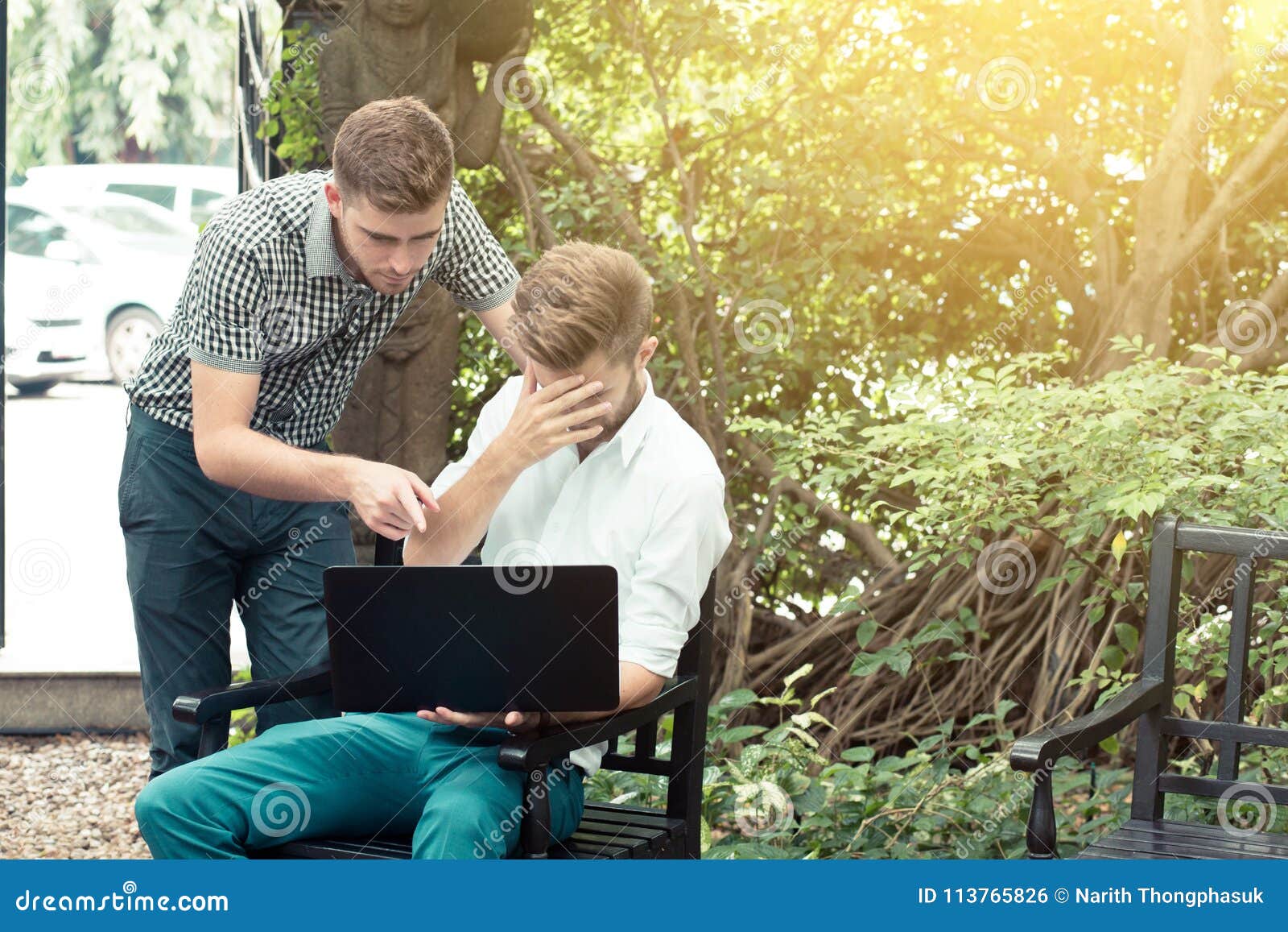 Two Business People Use of the Notebook Computer at Outdoor. Stock ...
