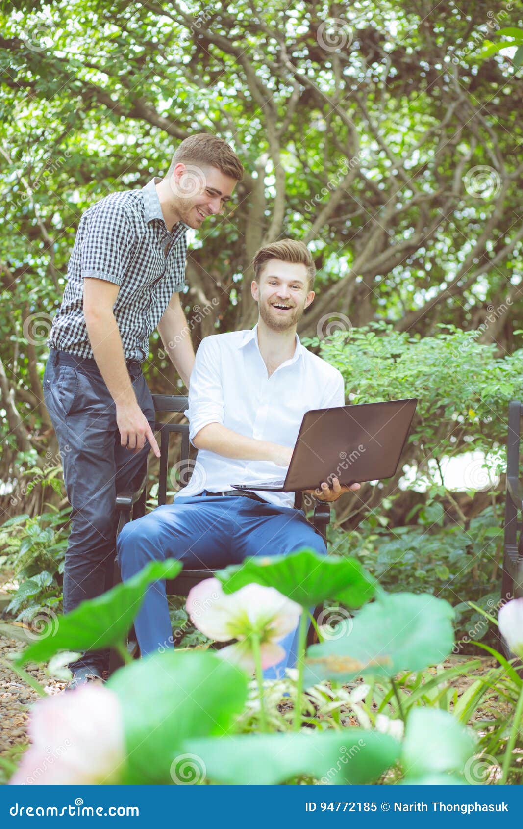 Two Business People Use of the Notebook Computer at Outdoor. Stock ...