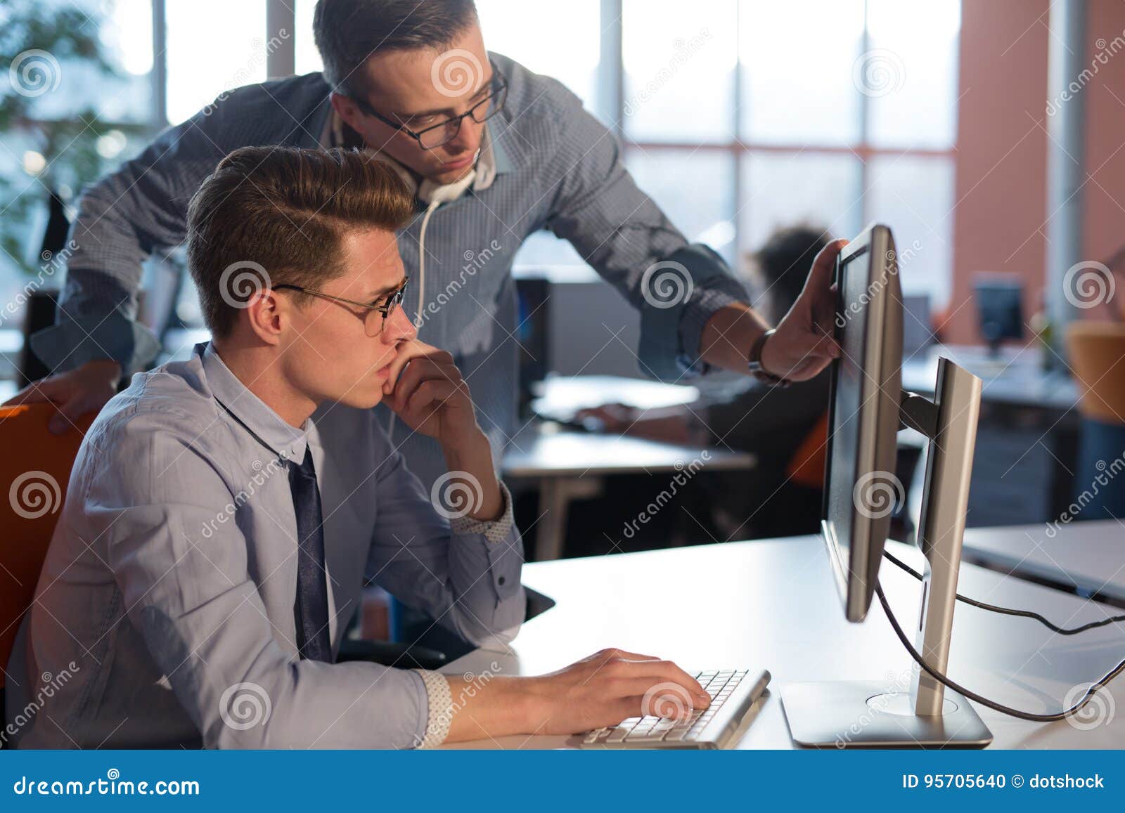 Two Business People Working with Computer in Office Stock Photo - Image ...