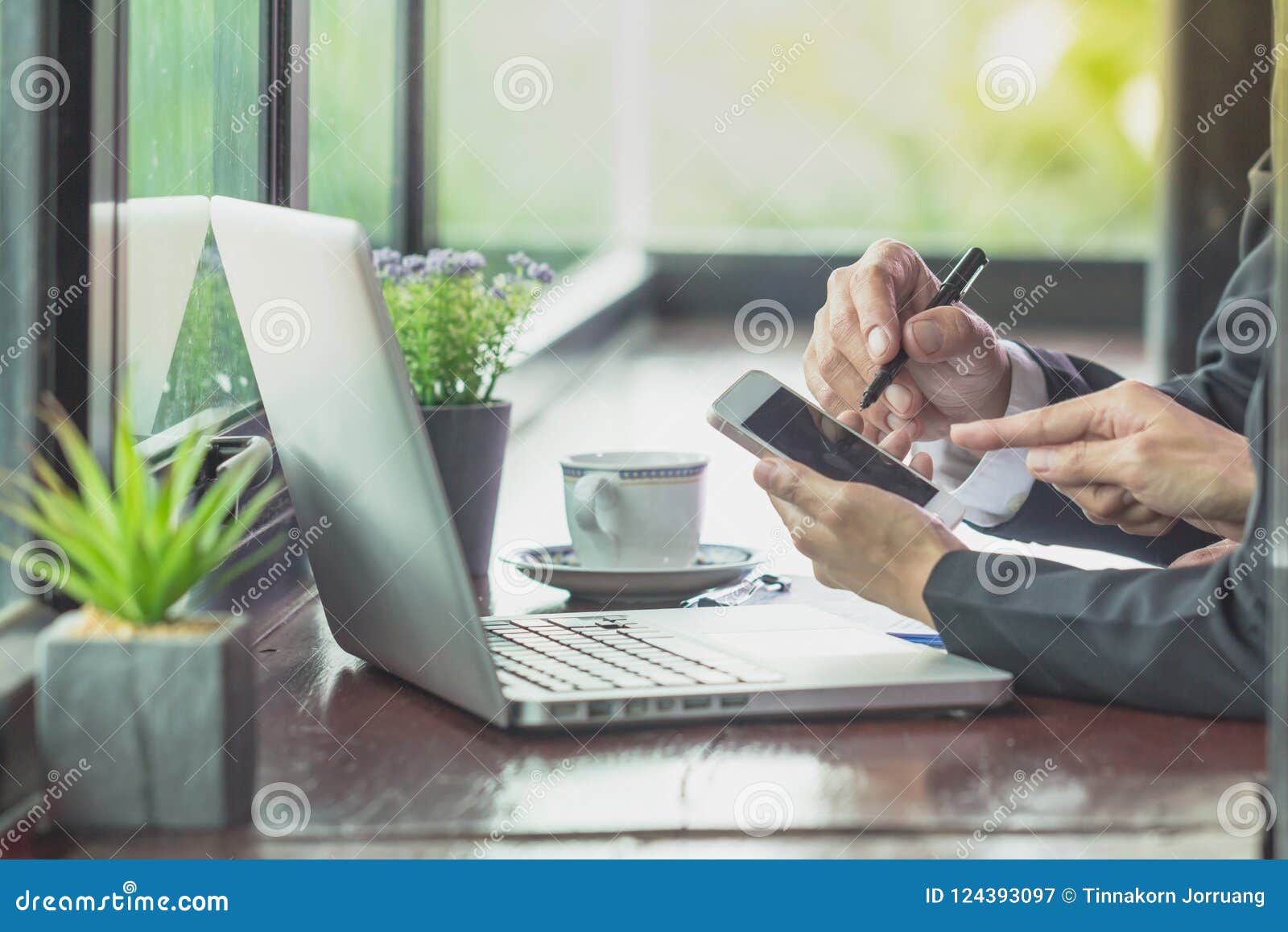Two Business People Using Mobile Phones while Working. Stock Image ...