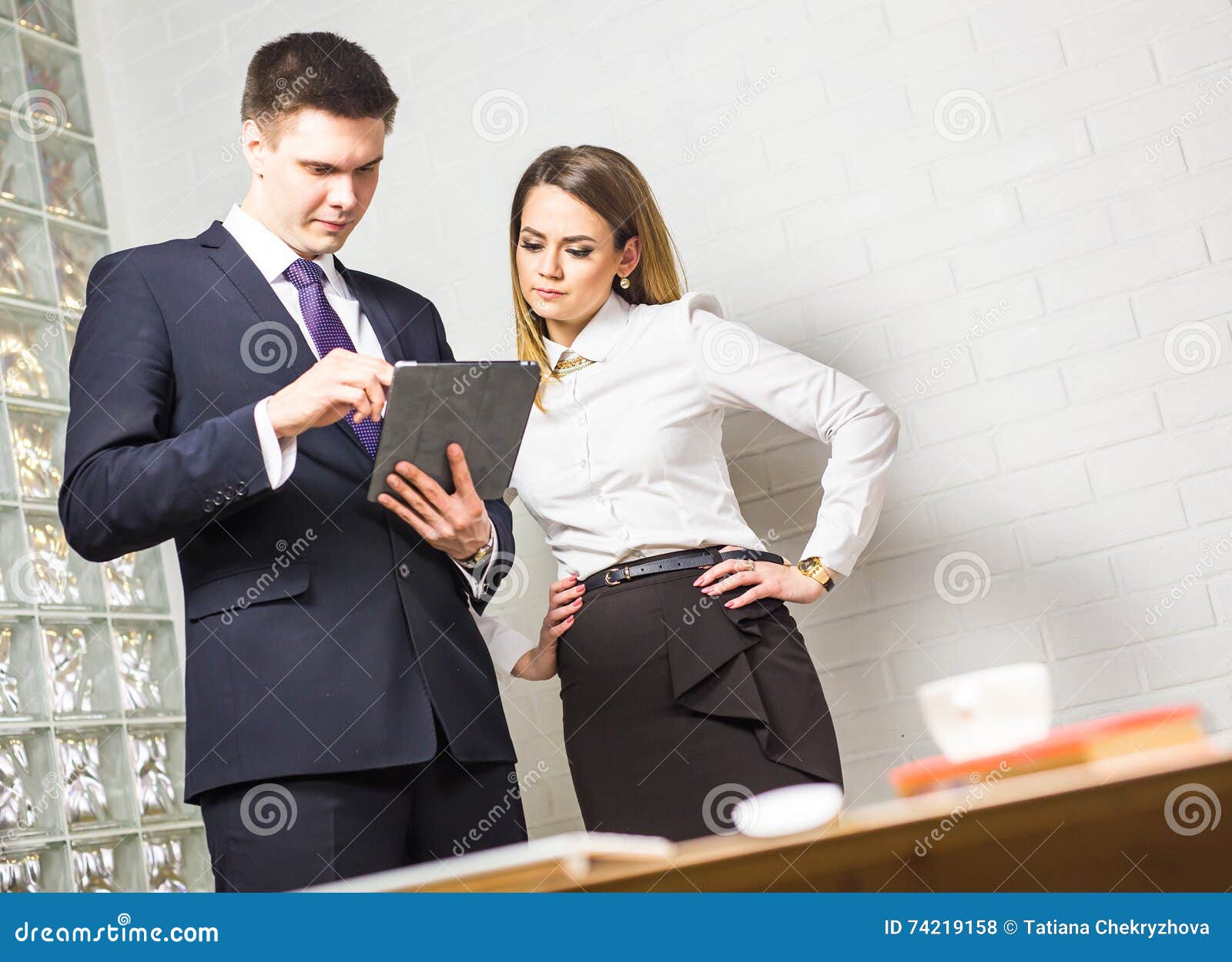 Two Business People Using Tablet Computer in Office Stock Photo - Image ...