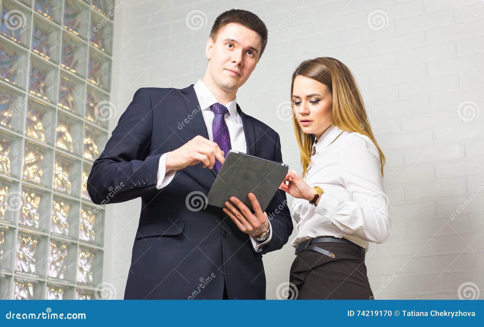 Two Business People Using Tablet Computer in Office Stock Photo - Image ...