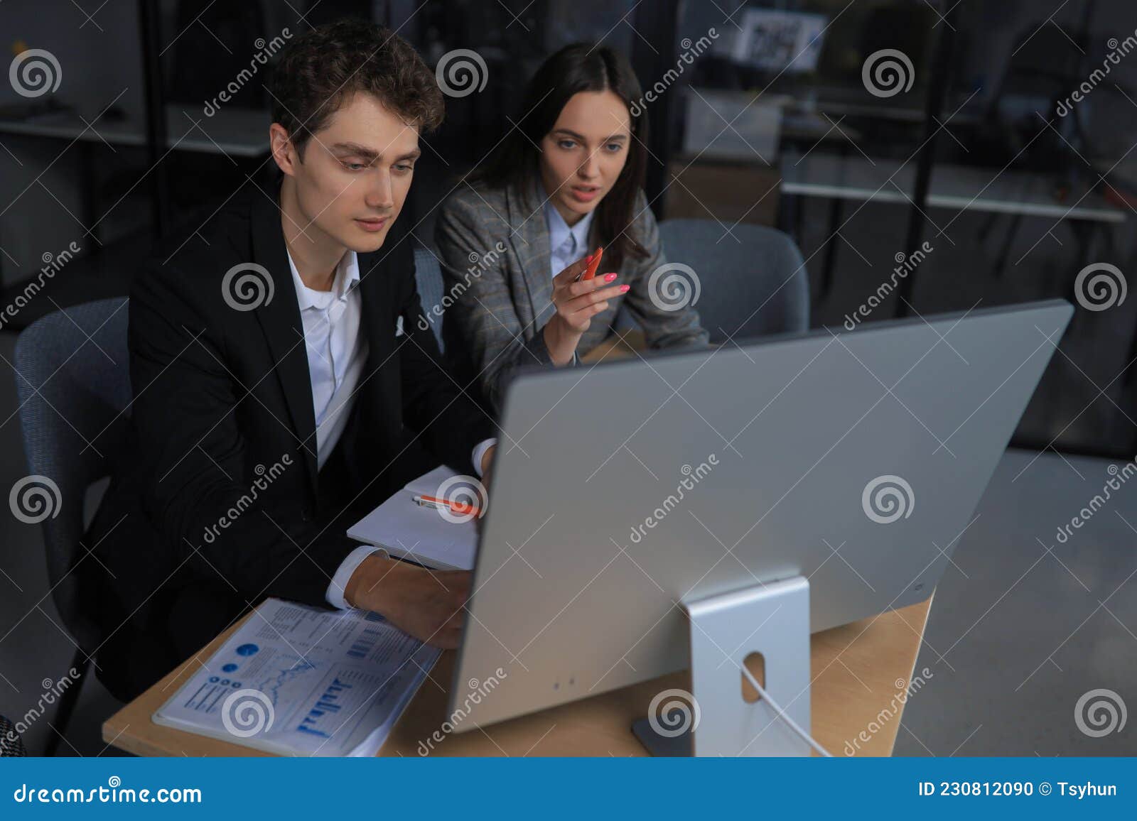 Two Business People Working Together on Computer. Stock Photo - Image ...