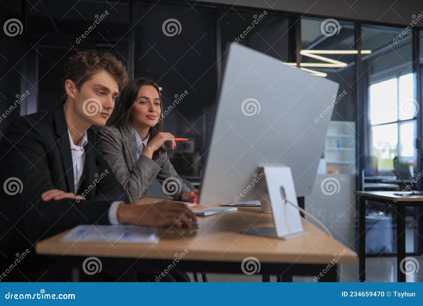 Two Business People Working Together on Computer. Stock Photo - Image ...