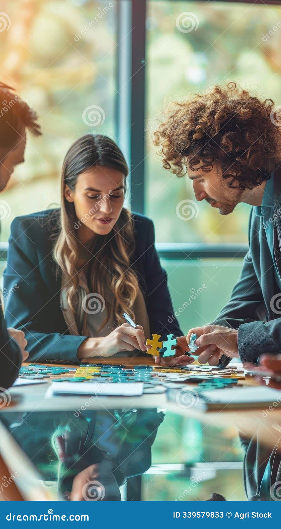 Two Business Professionals Working Together on a Puzzle Stock ...