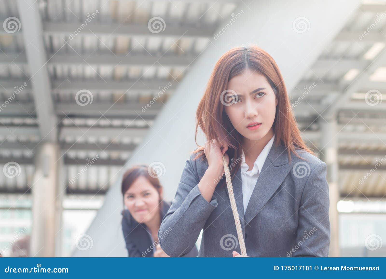 Two Business Women Pulling a Rope Competing with Commitment To Winer ...