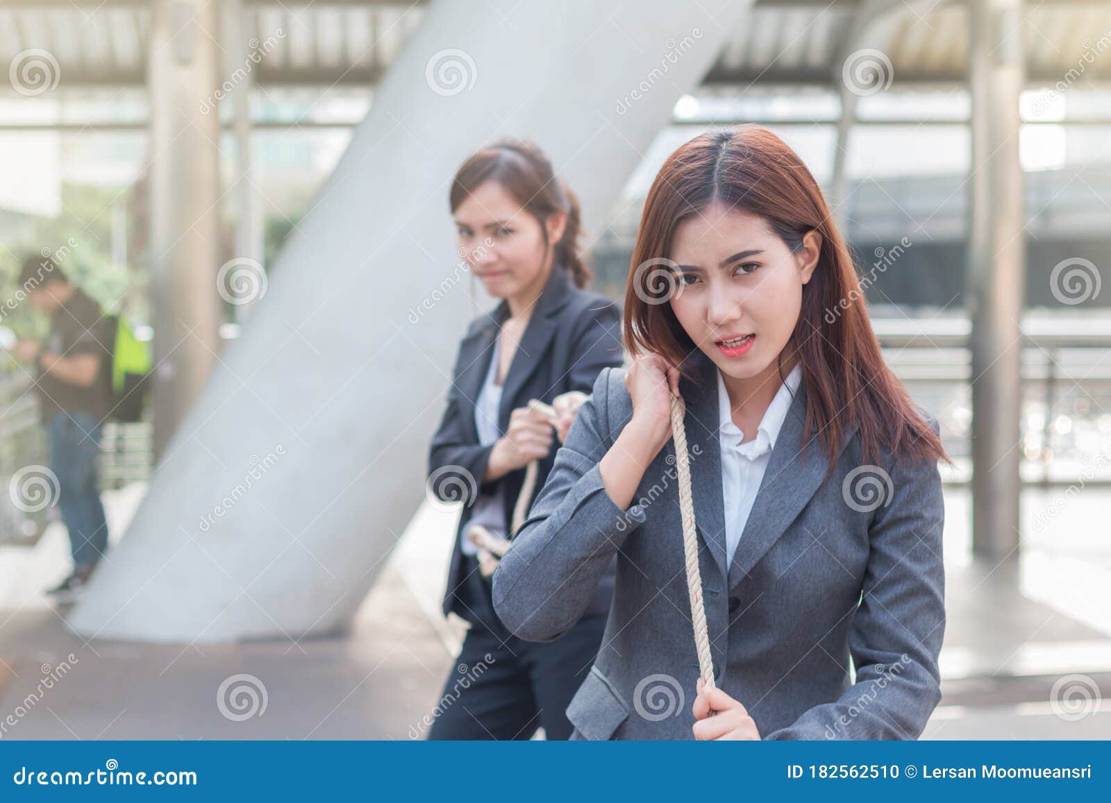 Two Business Women Pulling a Rope Competing with Commitment To Winer ...
