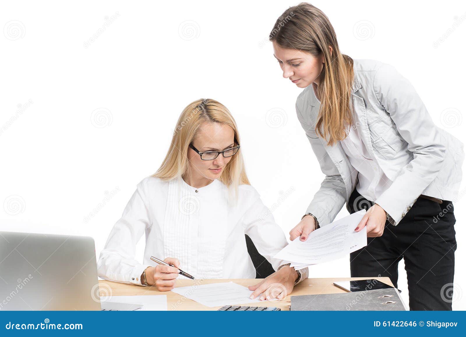 Two Business Women Talking and Signing Document Stock Photo - Image of ...