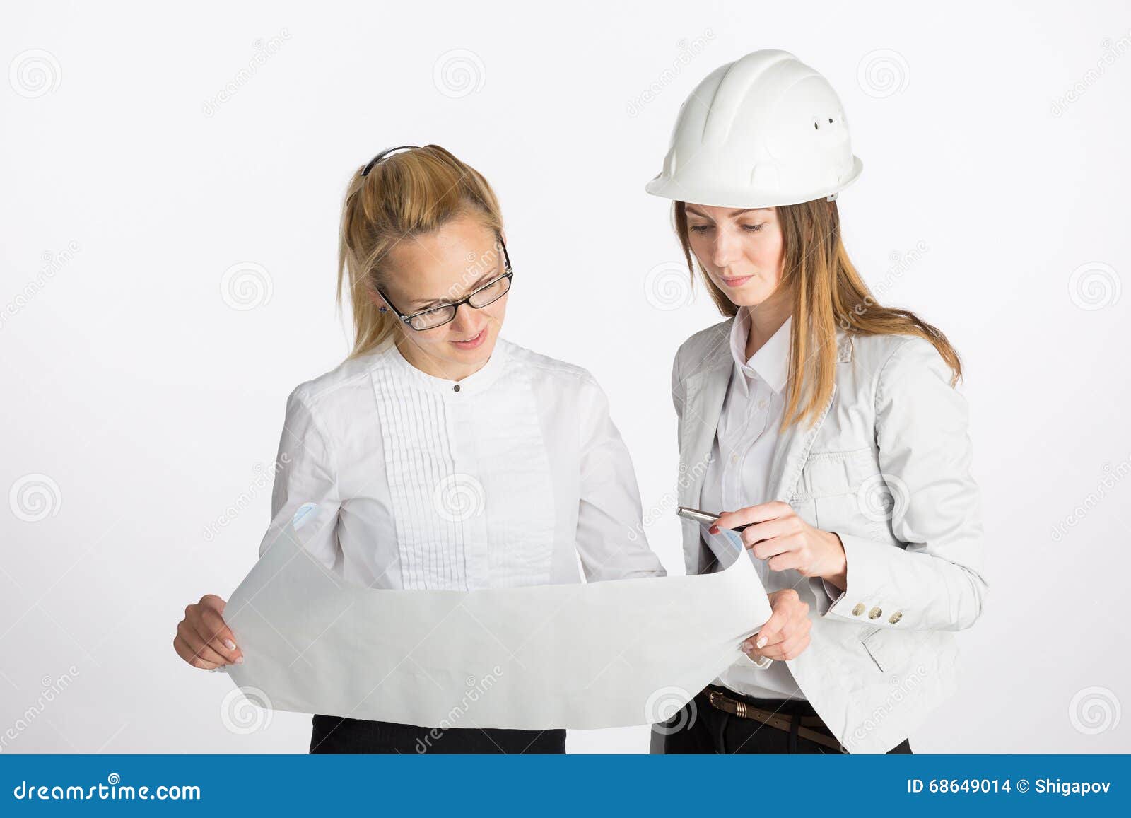 Two Business Women Talking and Signing Document Stock Photo - Image of ...
