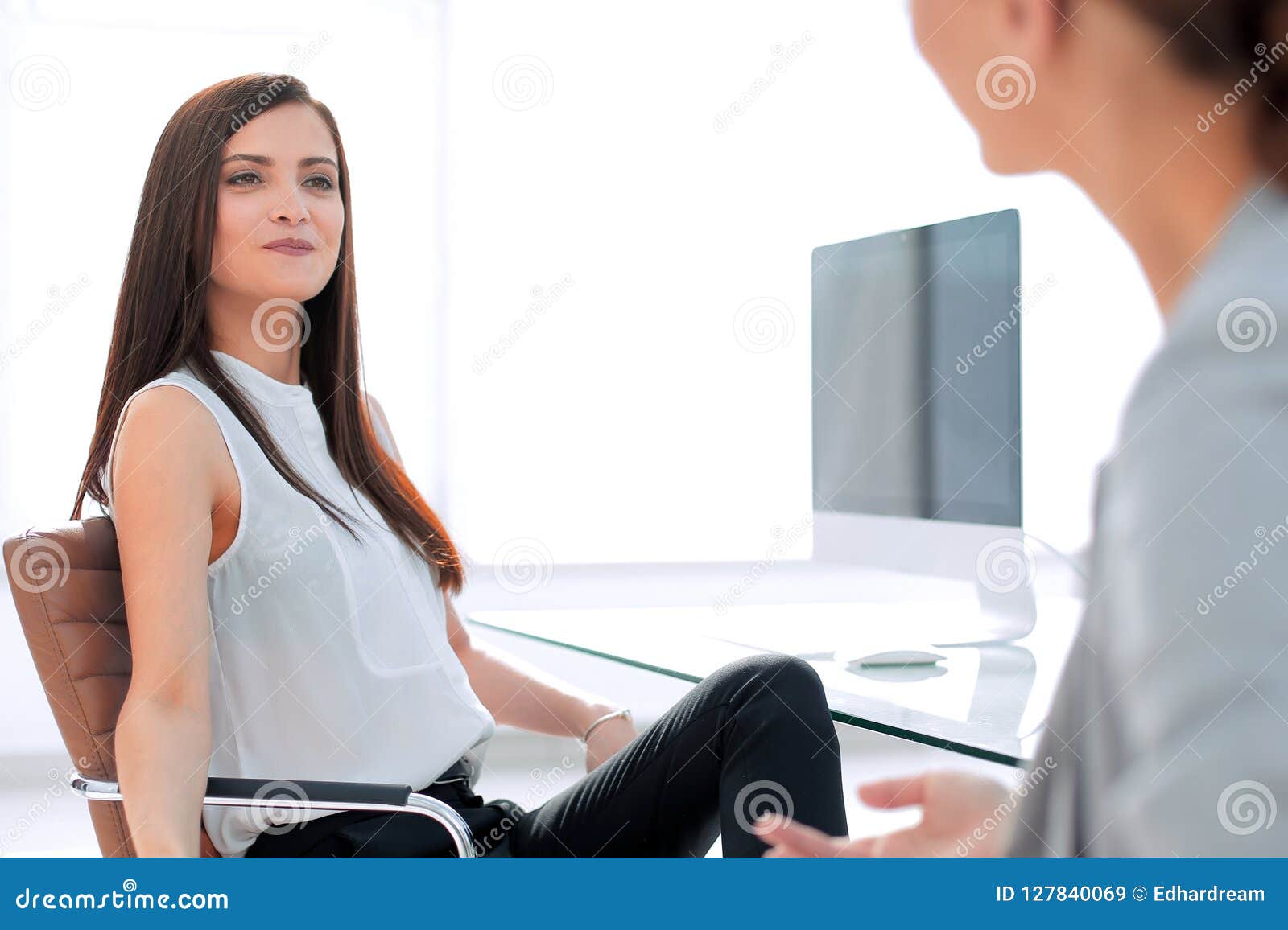 Two Business Women Talking in the Workplace Stock Image - Image of ...