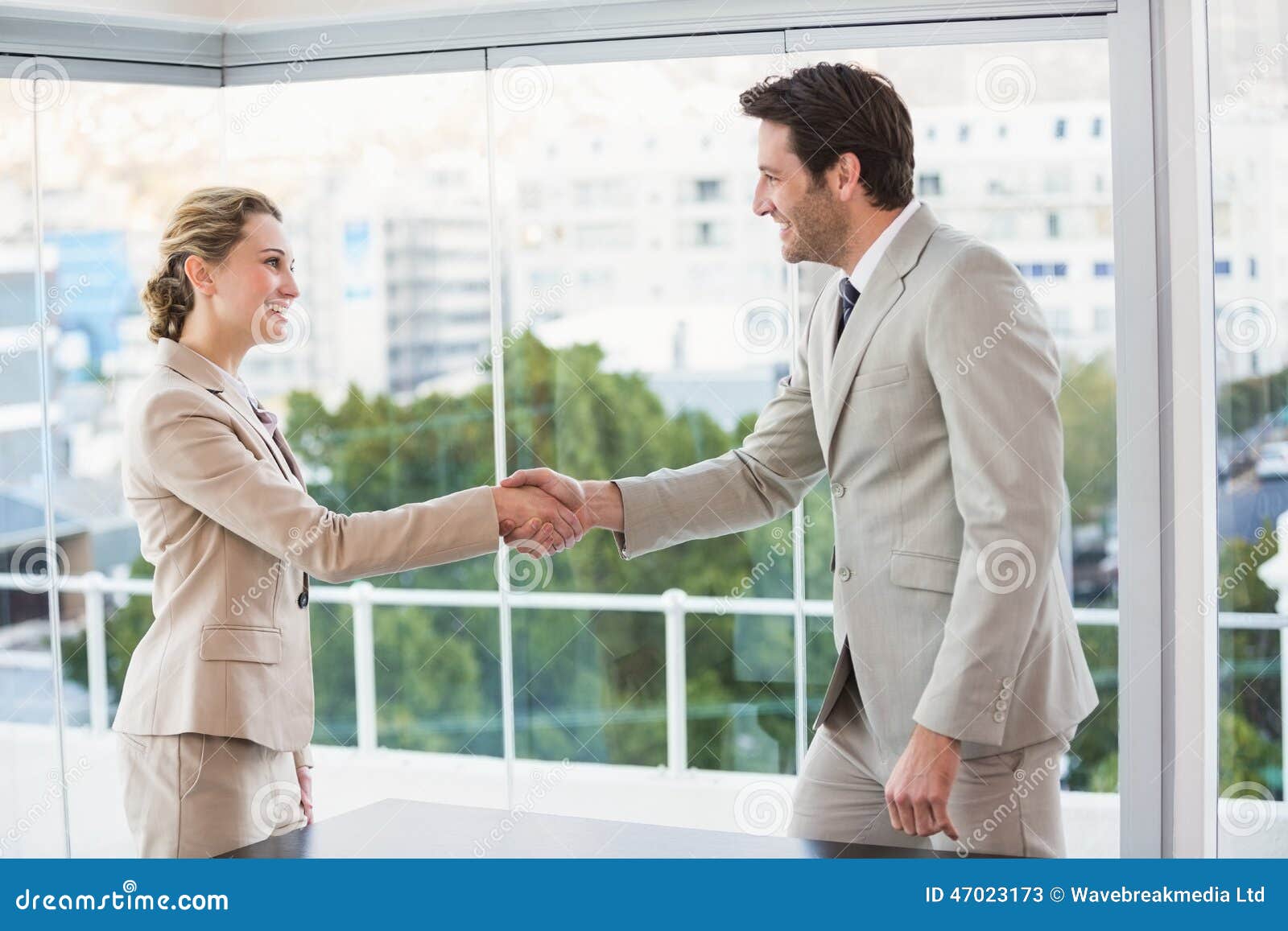 Two Business Workers Shake Hands Stock Image - Image of casual, male ...