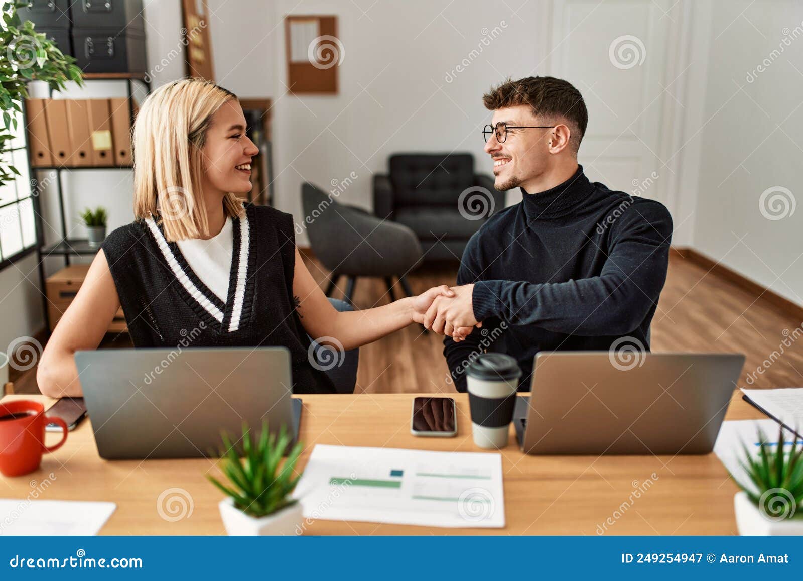 Two Business Workers Smiling Happy Shaking Hands at the Office Stock ...