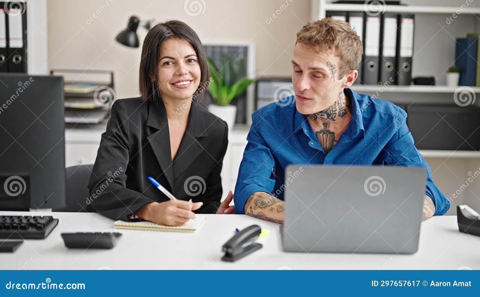 Two Business Workers Using Laptop Taking Notes at the Office Stock ...
