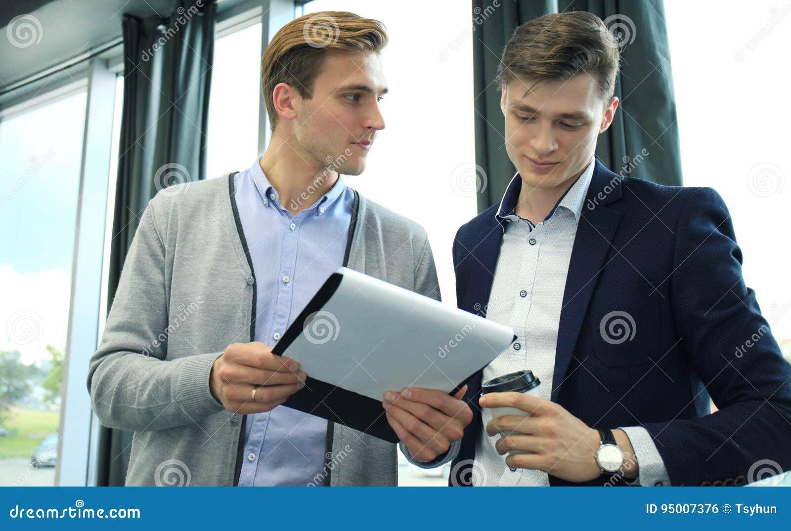 Two Businessman Dicussing Business in the Office. Stock Photo - Image ...