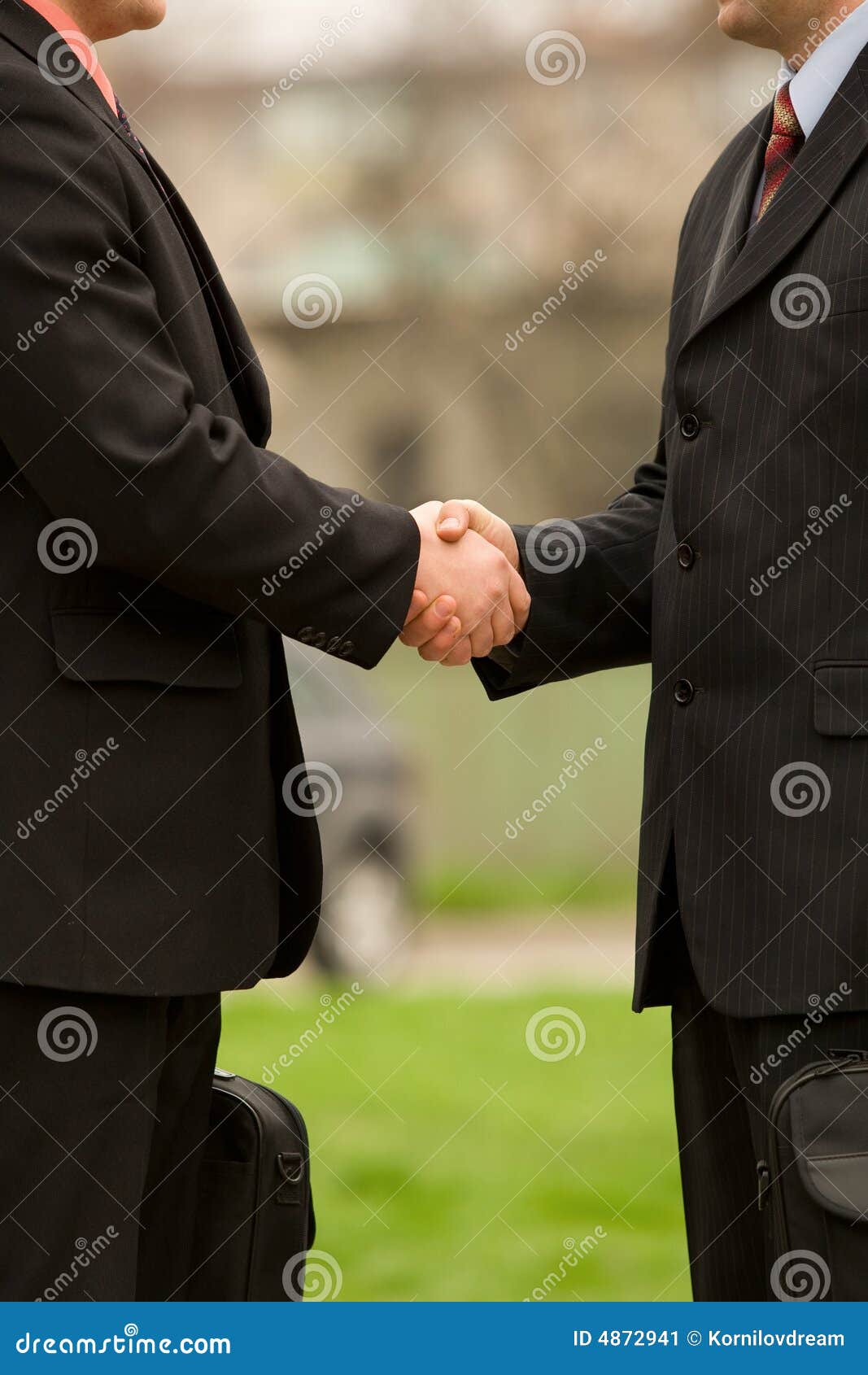 Two businessman handshake stock image. Image of clothing - 4872941