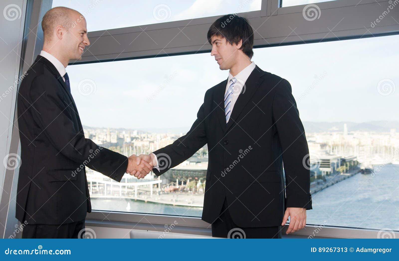 Two Businessman Making a Handshake Over a Deal Stock Image - Image of ... Two Businessman Making a Handshake Over a Deal Stock Image - Image of ...