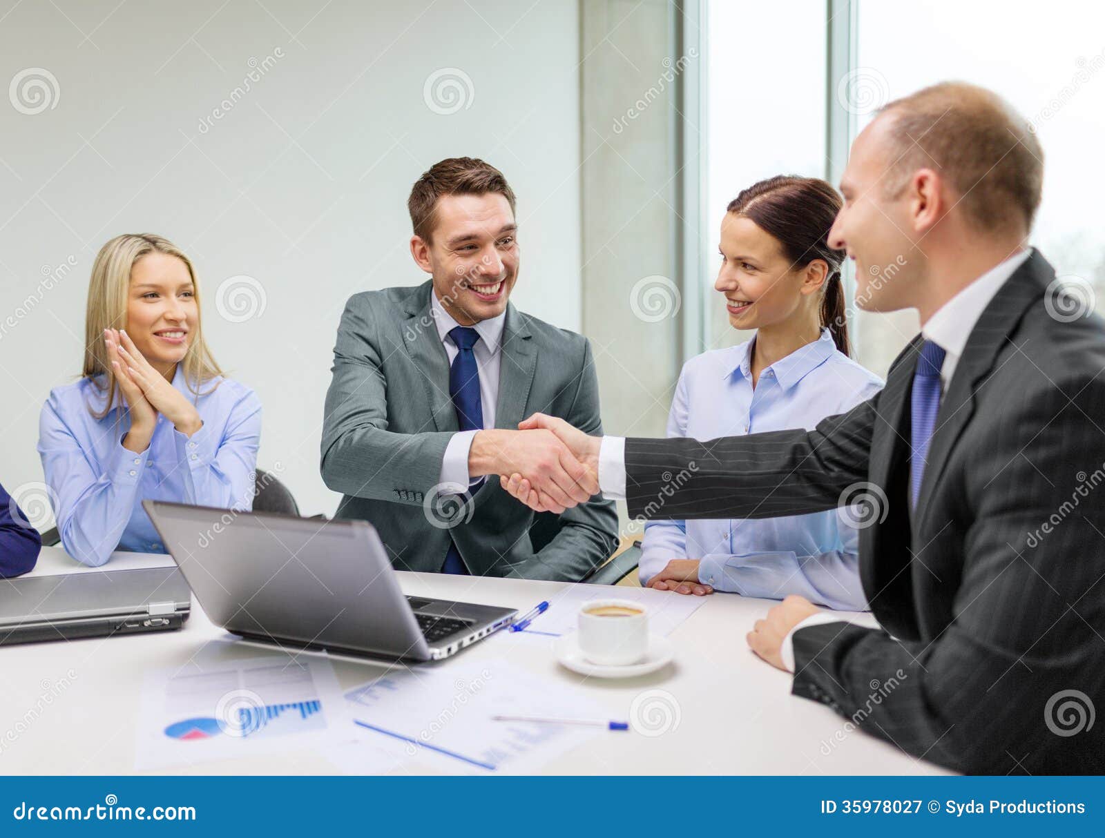 Two Businessman Shaking Hands in Office Stock Image - Image of papers ...