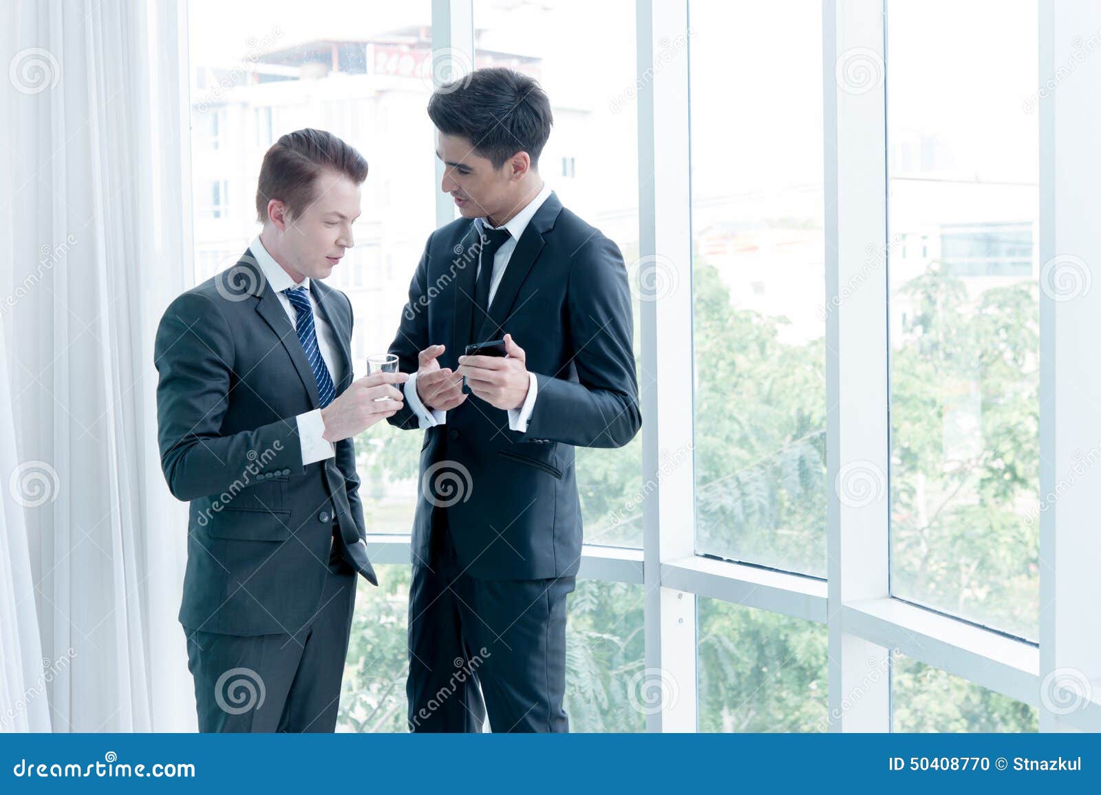 Two Businessman Talking with Mobile Phone Stock Photo - Image of gadget ...