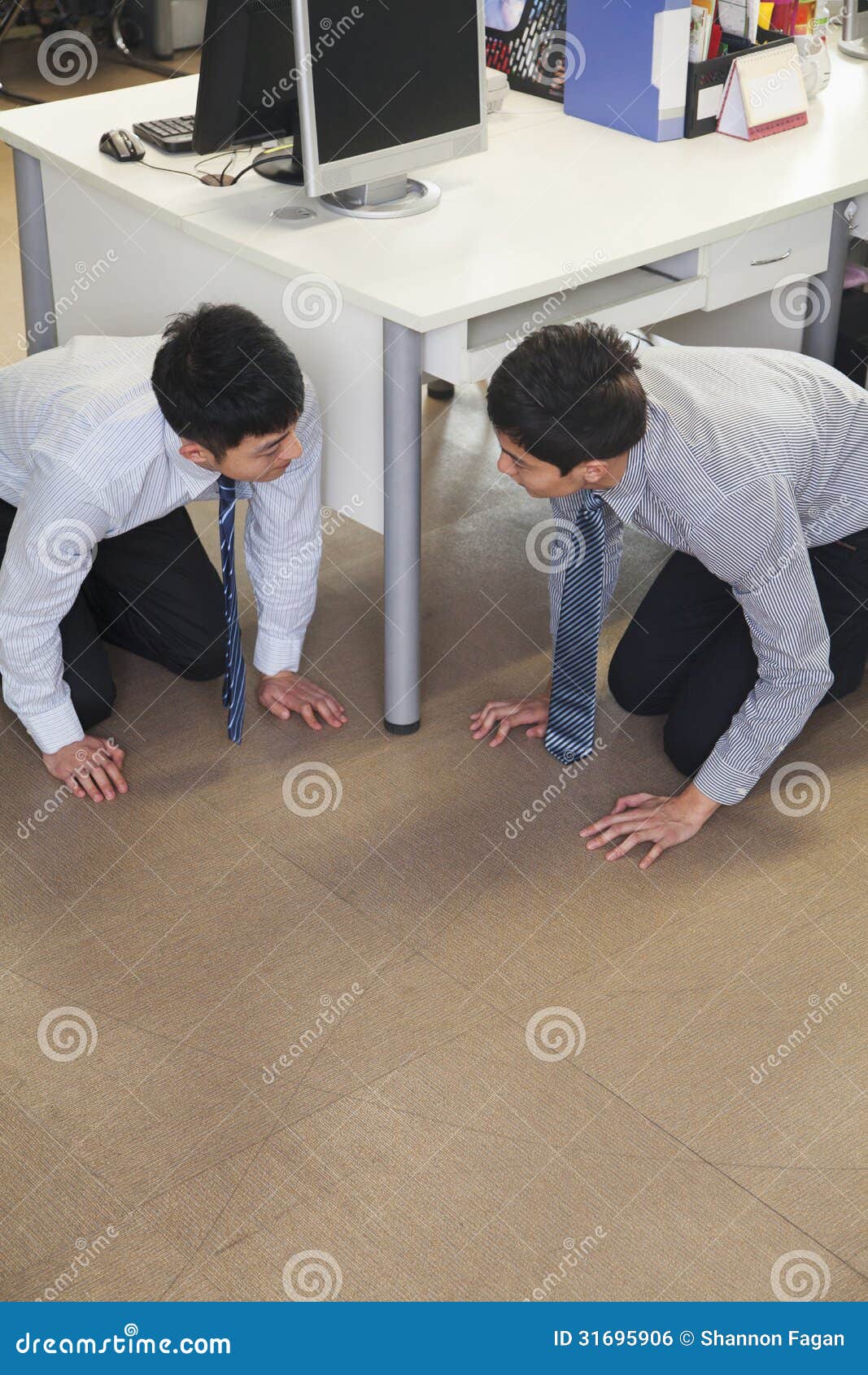 Two Businessmen Crouching on the Floor Stock Photo - Image of people ...