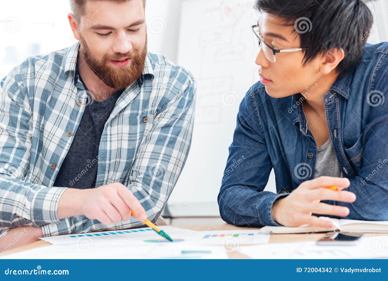 Two Businessmen Discussing Business Plan in Office Stock Photo - Image ...