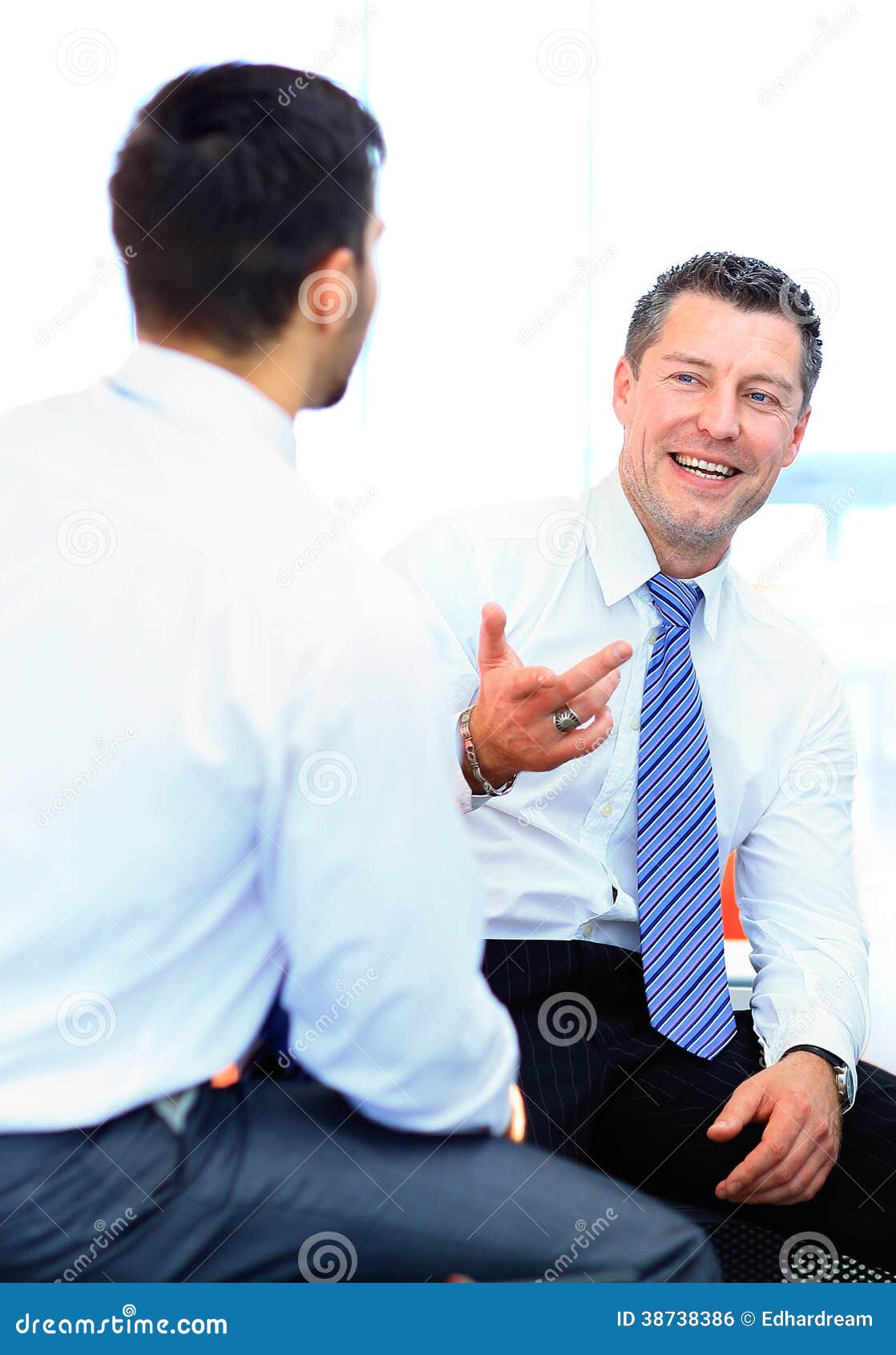 Two Businessmen Discussing Tasks Sitting Stock Photo - Image of ...