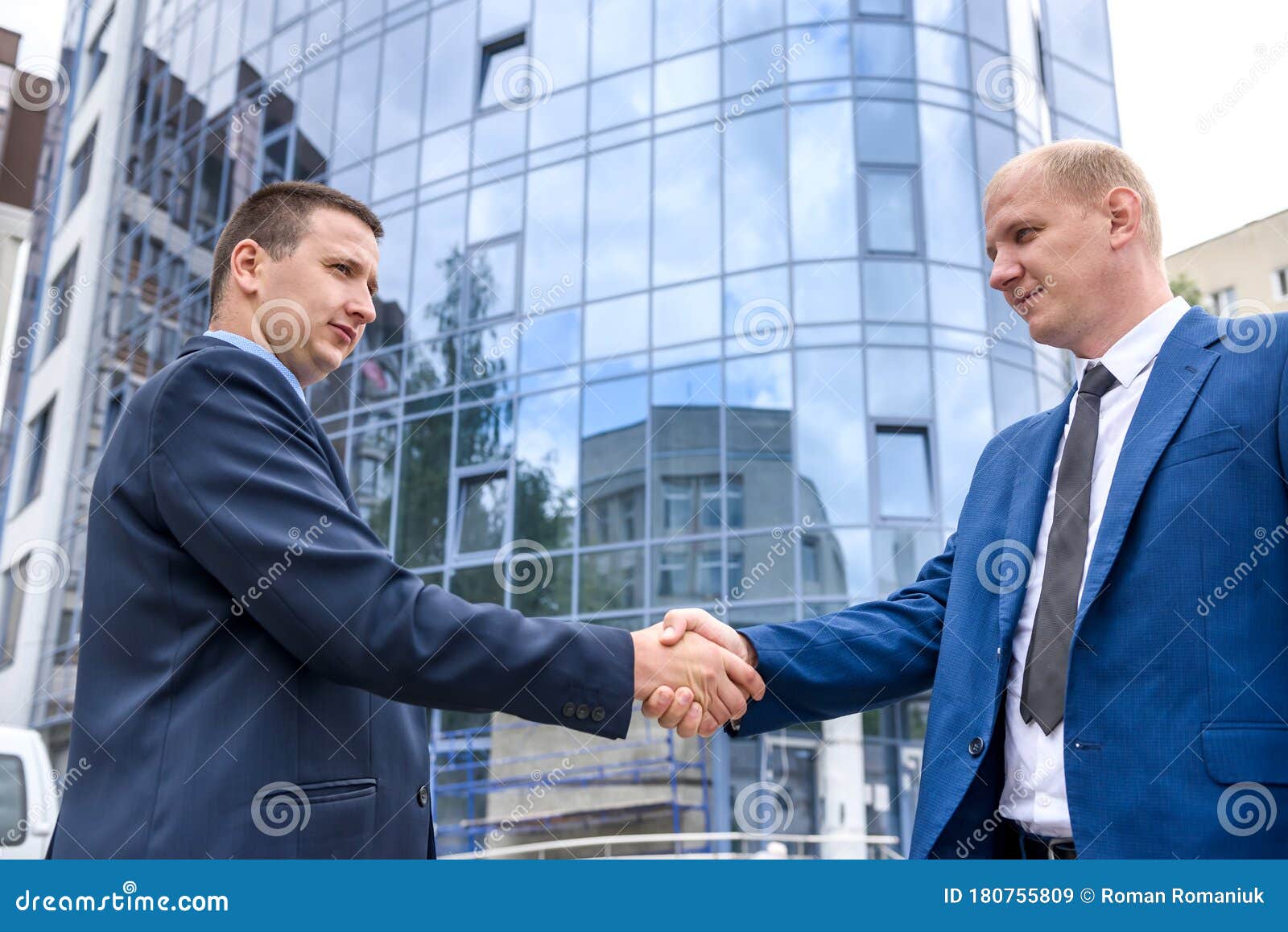 Two Businessmen Handshaking before New Building Outdoors Stock Image ...