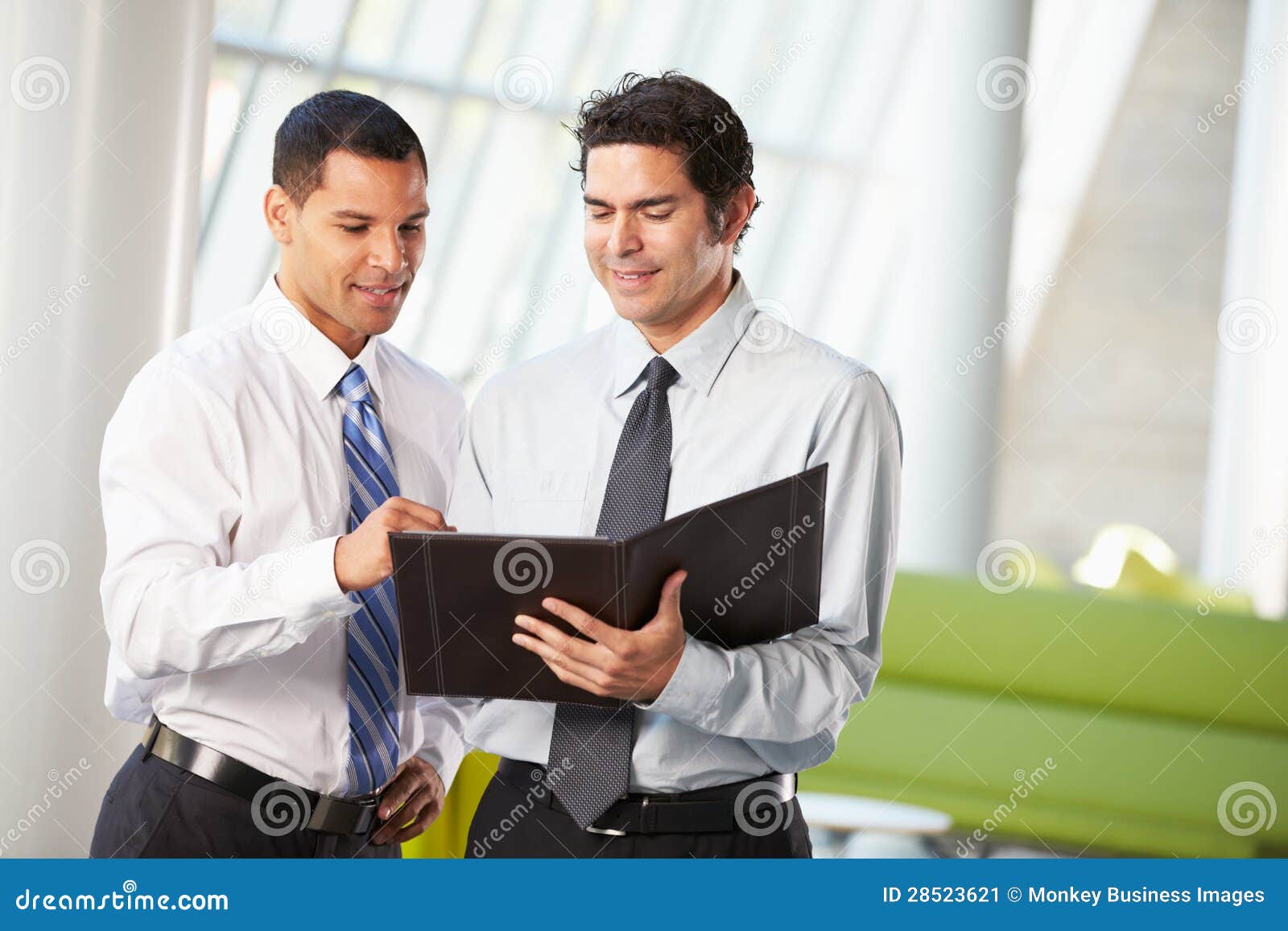 Two Businessmen Having Informal Meeting in Modern Office Stock Image ...