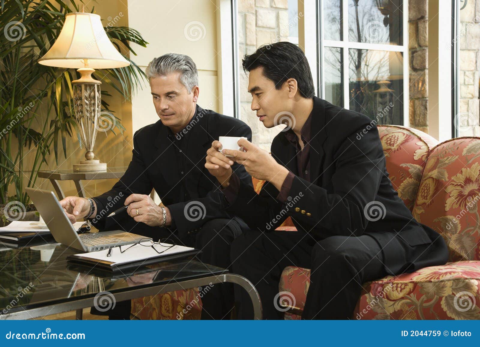 Two businessmen at hotel. stock image. Image of photograph - 2044759