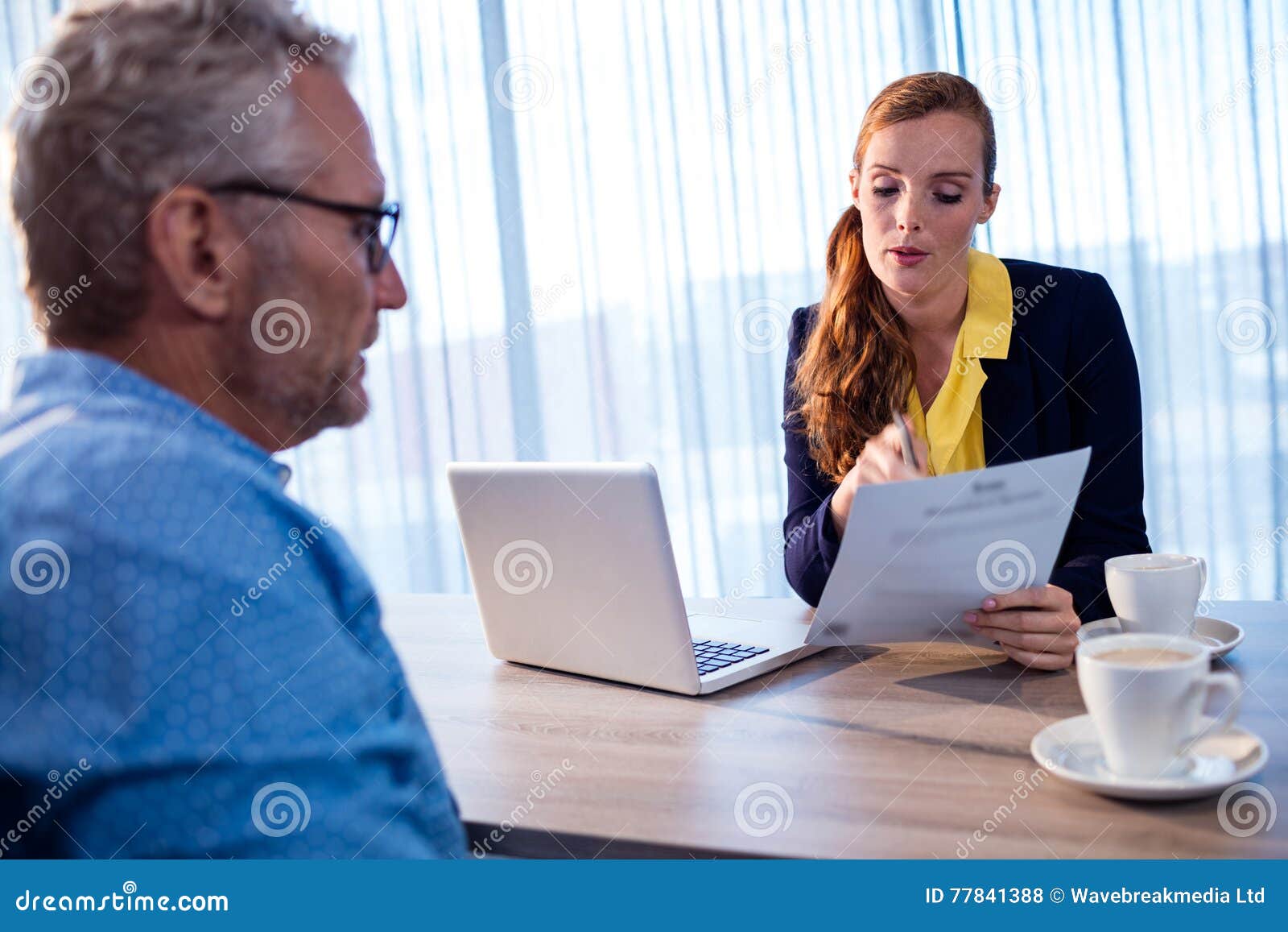 Two Businessmen Interacting Stock Photo - Image of notebooks, documents ...