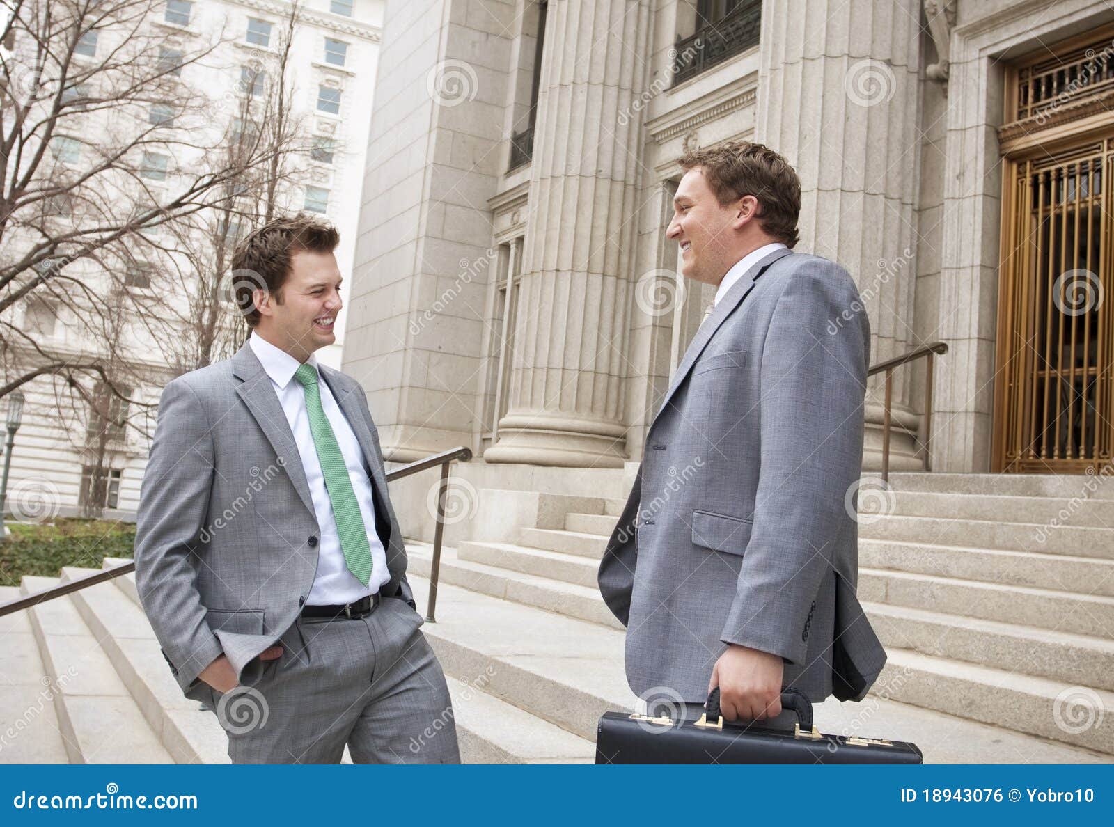 Two Businessmen Laughing Together Stock Photo - Image of outdoors ...