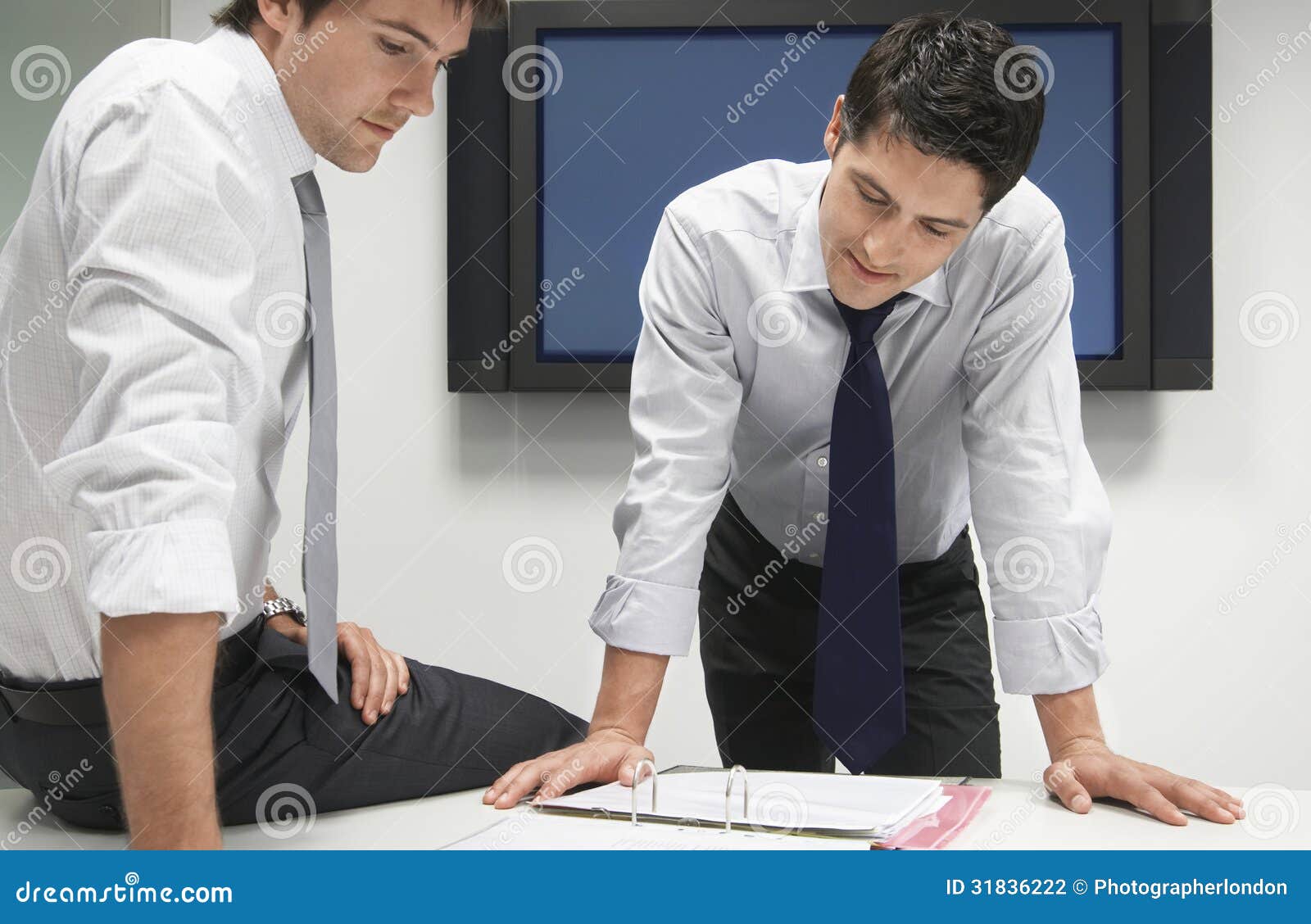 Two Businessmen Looking in File Folder Stock Photo - Image of meeting ...
