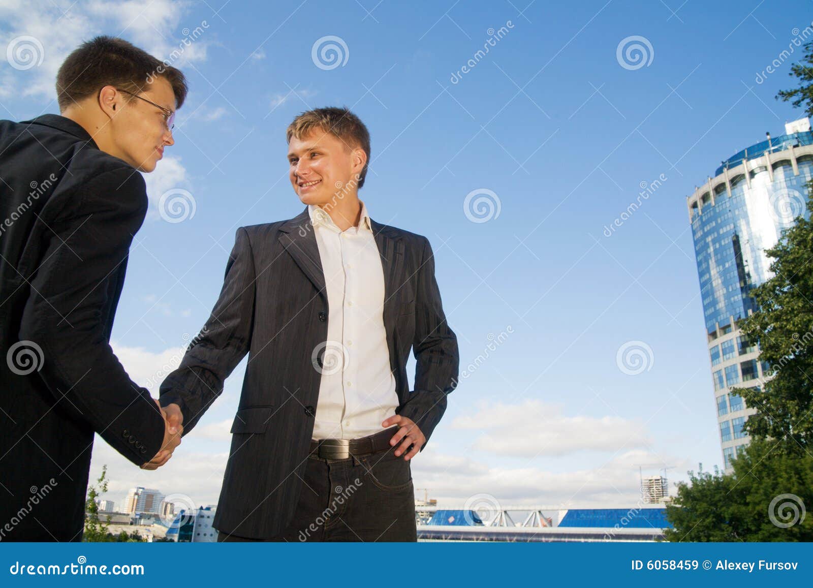 Two Businessmen Shaking Hands Stock Image - Image of glad, group: 6058459
