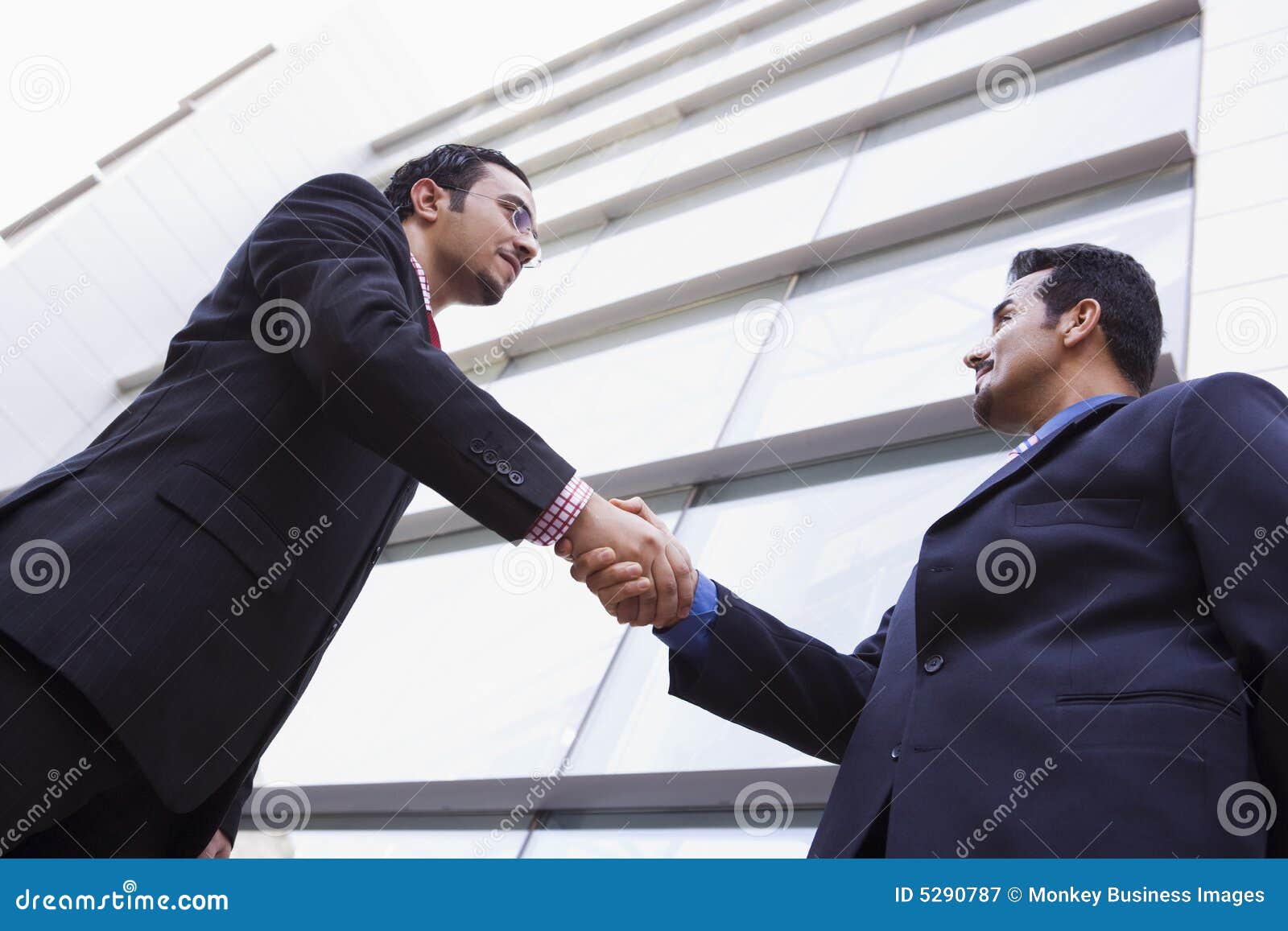 Two Businessmen Shaking Hands Outside Office Build Stock Image - Image ...