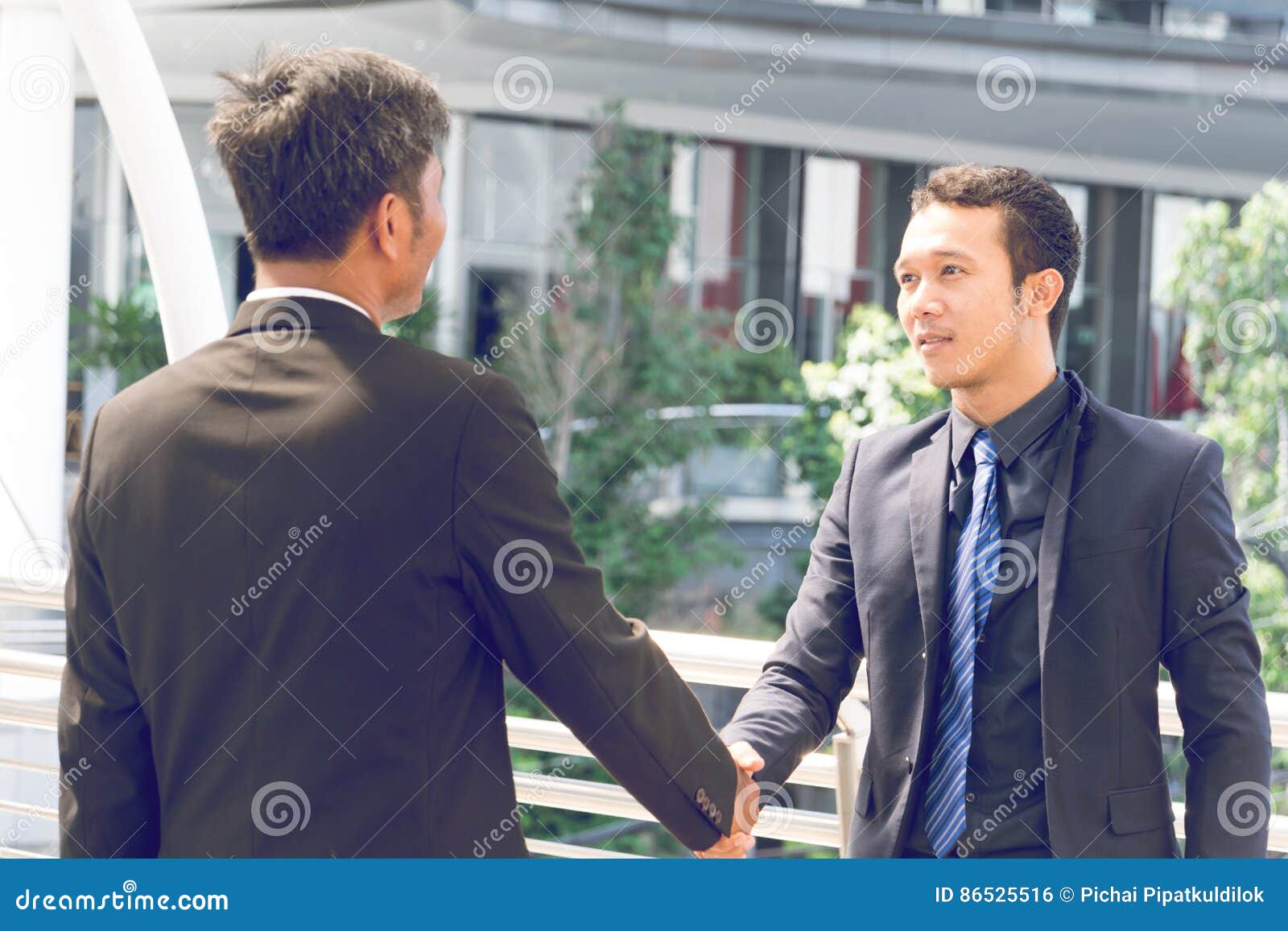 Two Businessmen are Shaking Hands Stock Photo - Image of businessmen ...