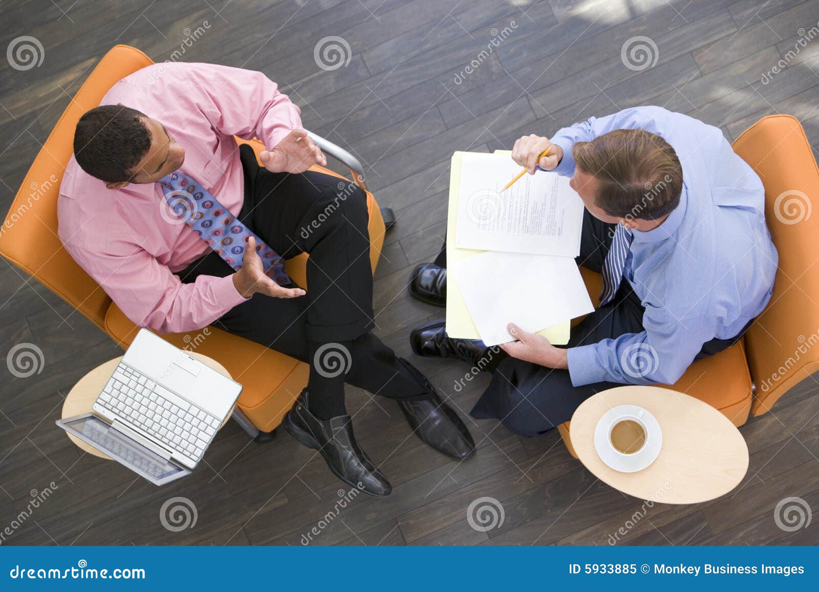 Two Businessmen Sitting Indoors Having a Meeting Stock Image - Image of ...