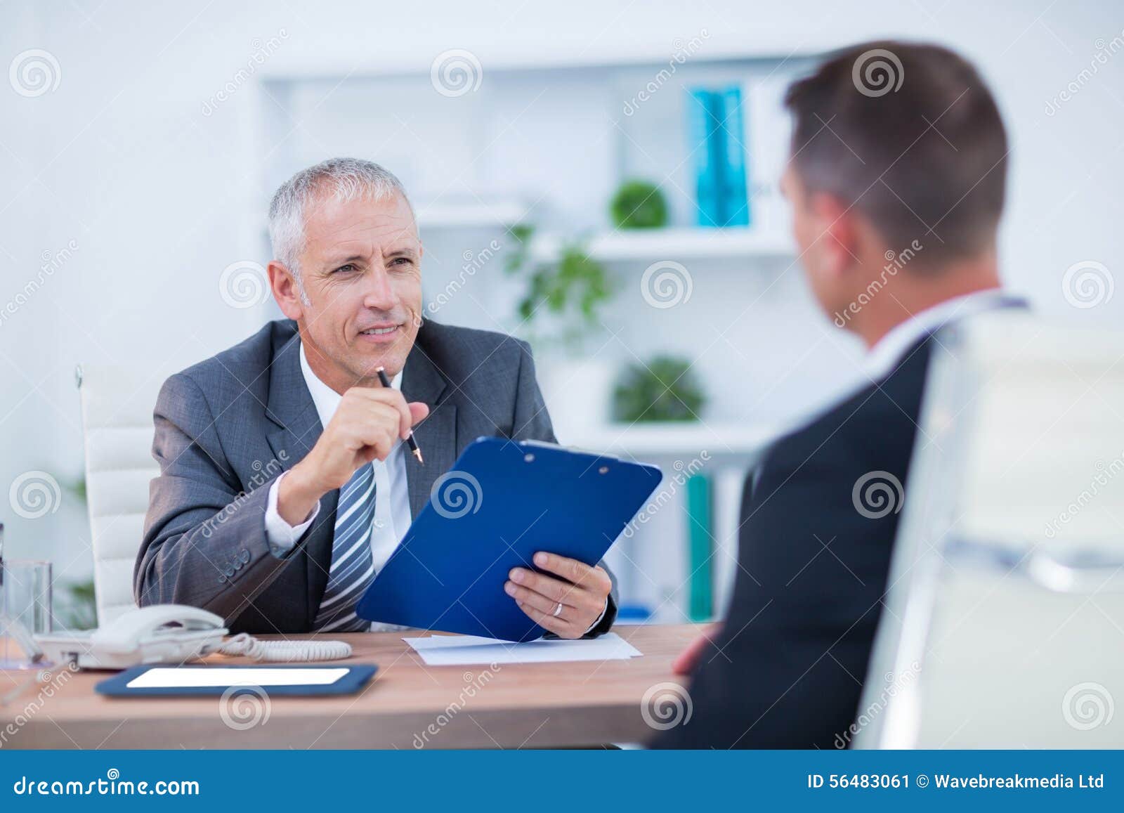 Two Businessmen Sitting and Speaking and Working Stock Image - Image of ...