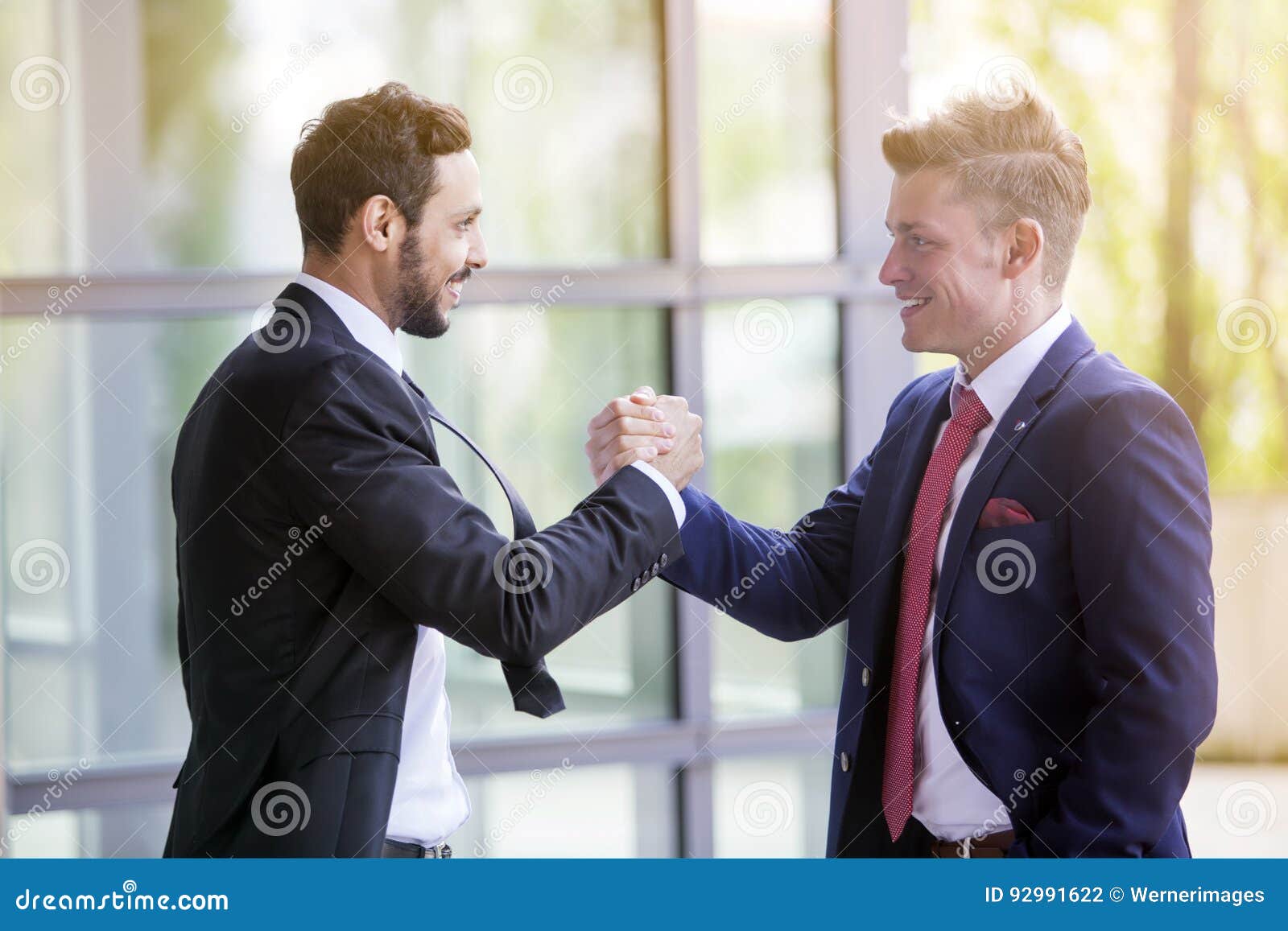 Two Businessmen Smiling and Shaking Hands Stock Photo - Image of ...