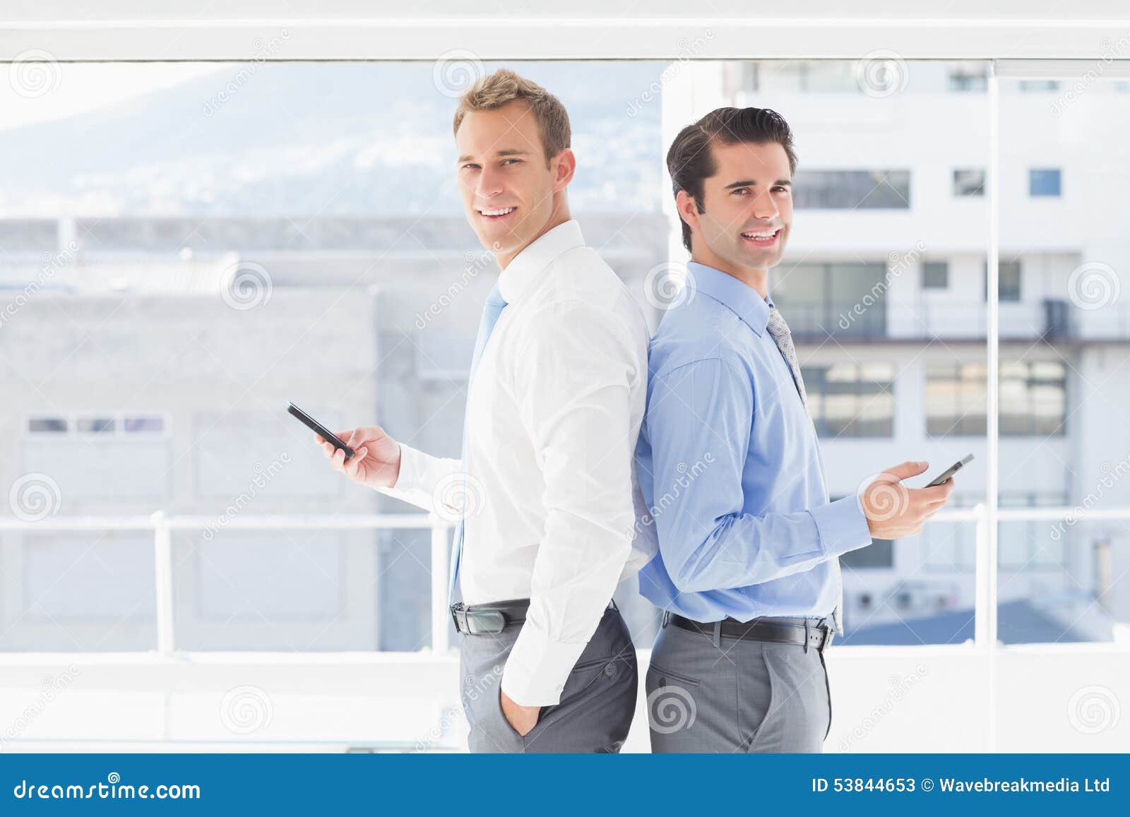 Two Businessmen Standing Back To Back Stock Image - Image of ...