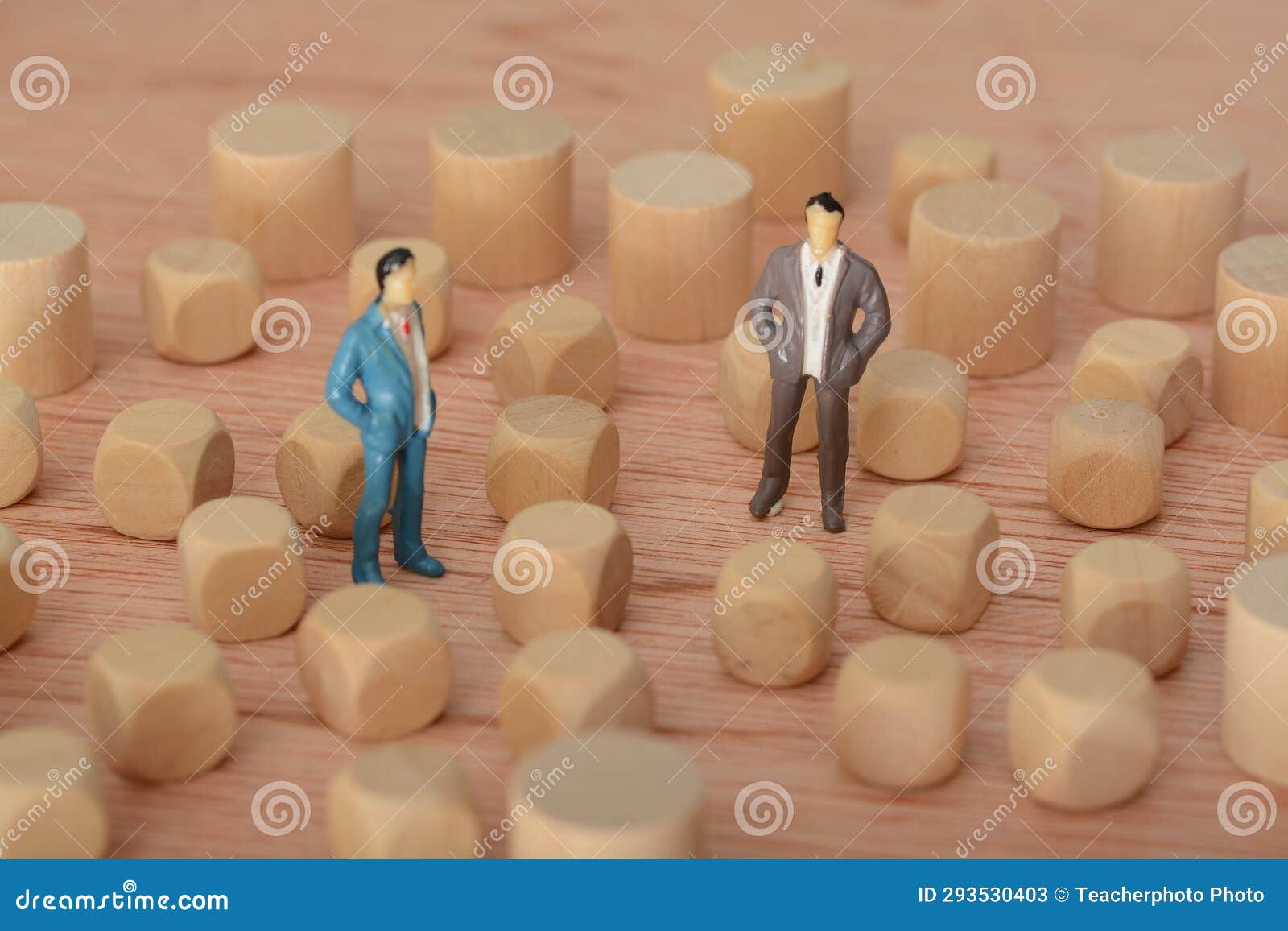 Two Businessmen Stood Amidst Surrounding Wooden Blocks, Facing the ...