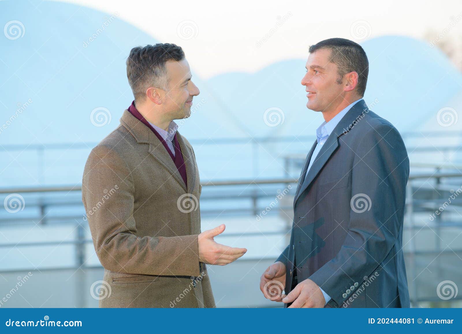 Two Businessmen Talking Outdoors Stock Image - Image of businessperson ...