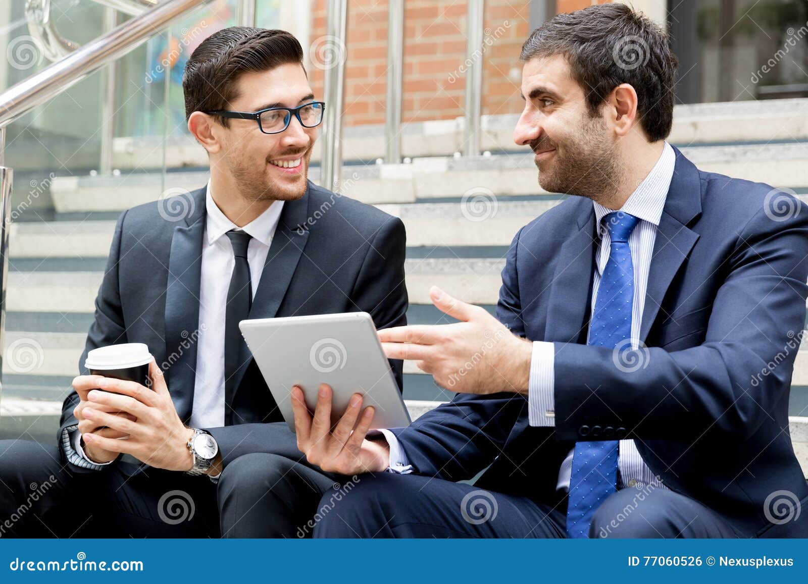 Two Businessmen Talking Outdoors Stock Photo - Image of chatting, suit ...