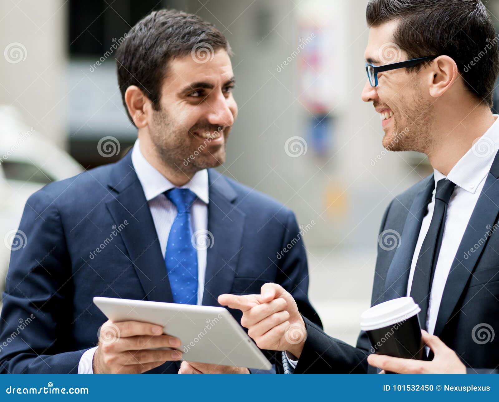 Two Businessmen Talking Outdoors Stock Photo - Image of talking, coffee ...
