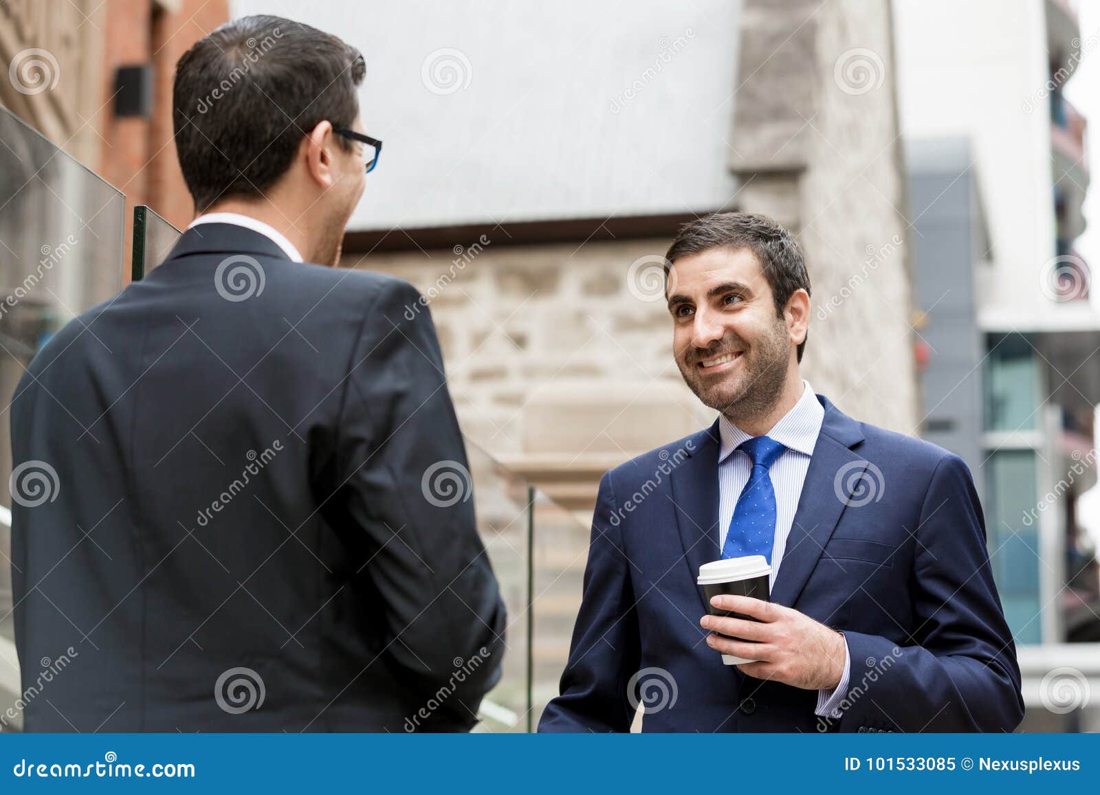 Two Businessmen Talking Outdoors Stock Image - Image of caucasian ...