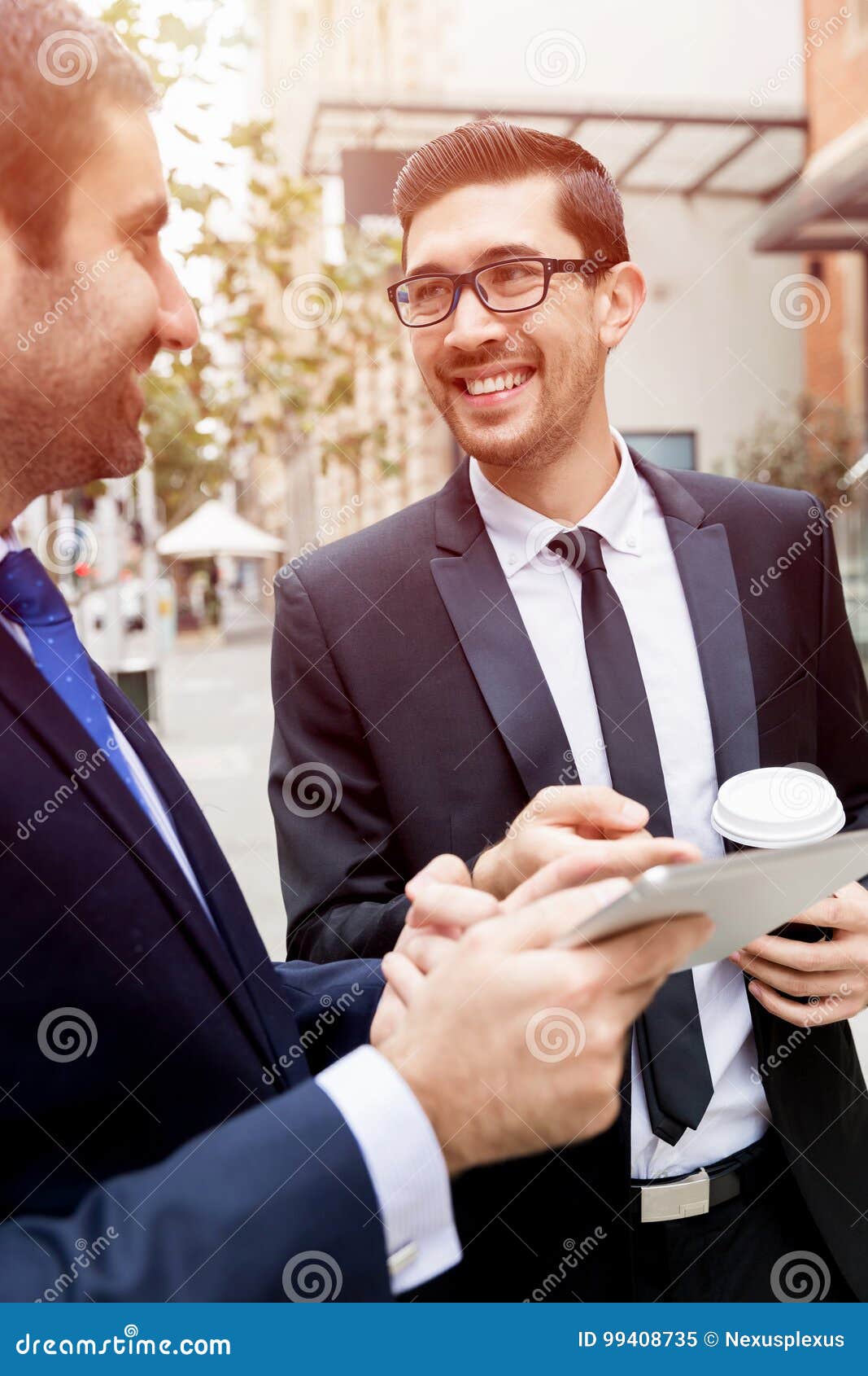 Two Businessmen Talking Outdoors Stock Image - Image of suit, city ...
