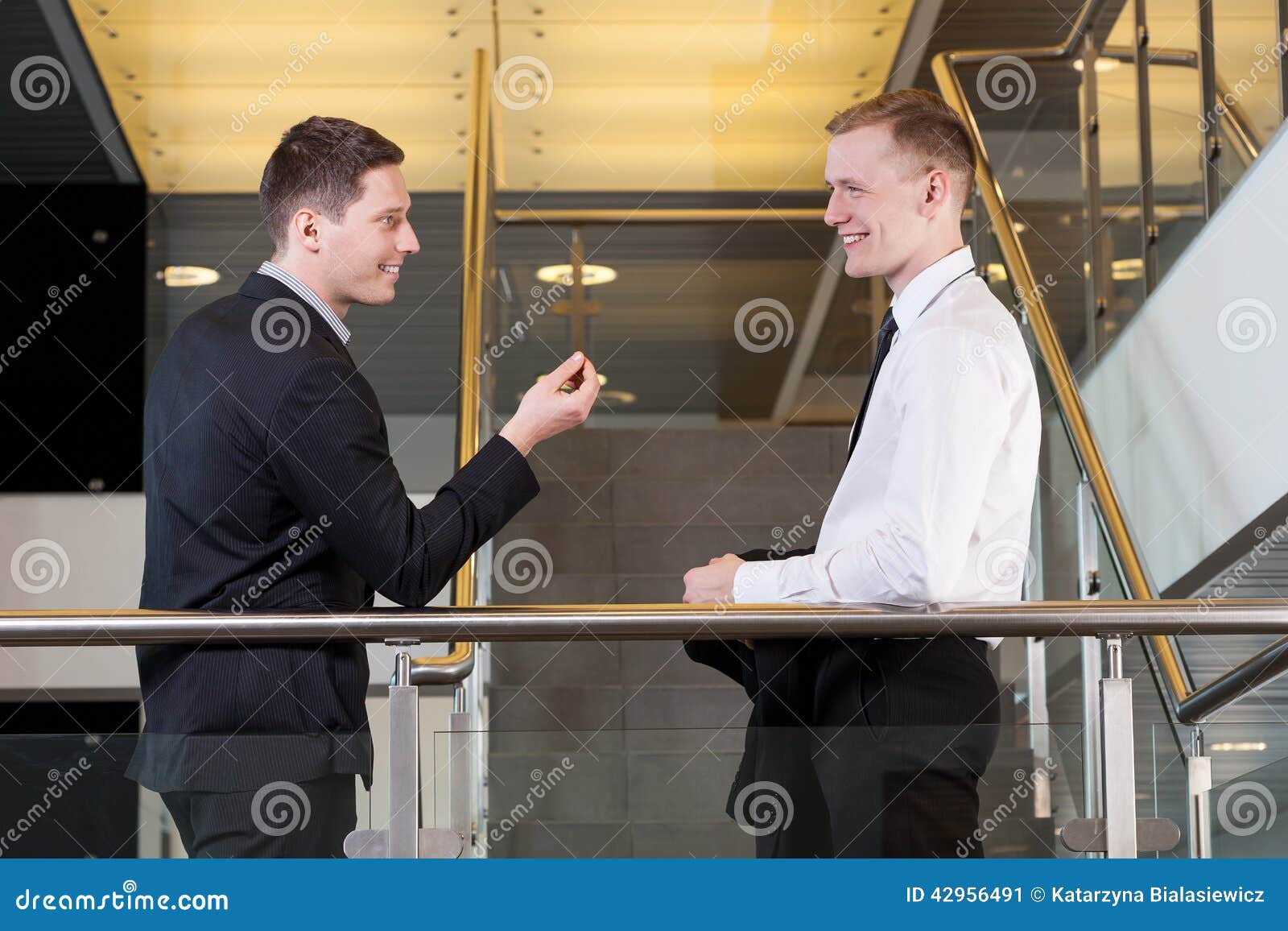 Two Businessmen Talking To Each Other Stock Image - Image of company ...